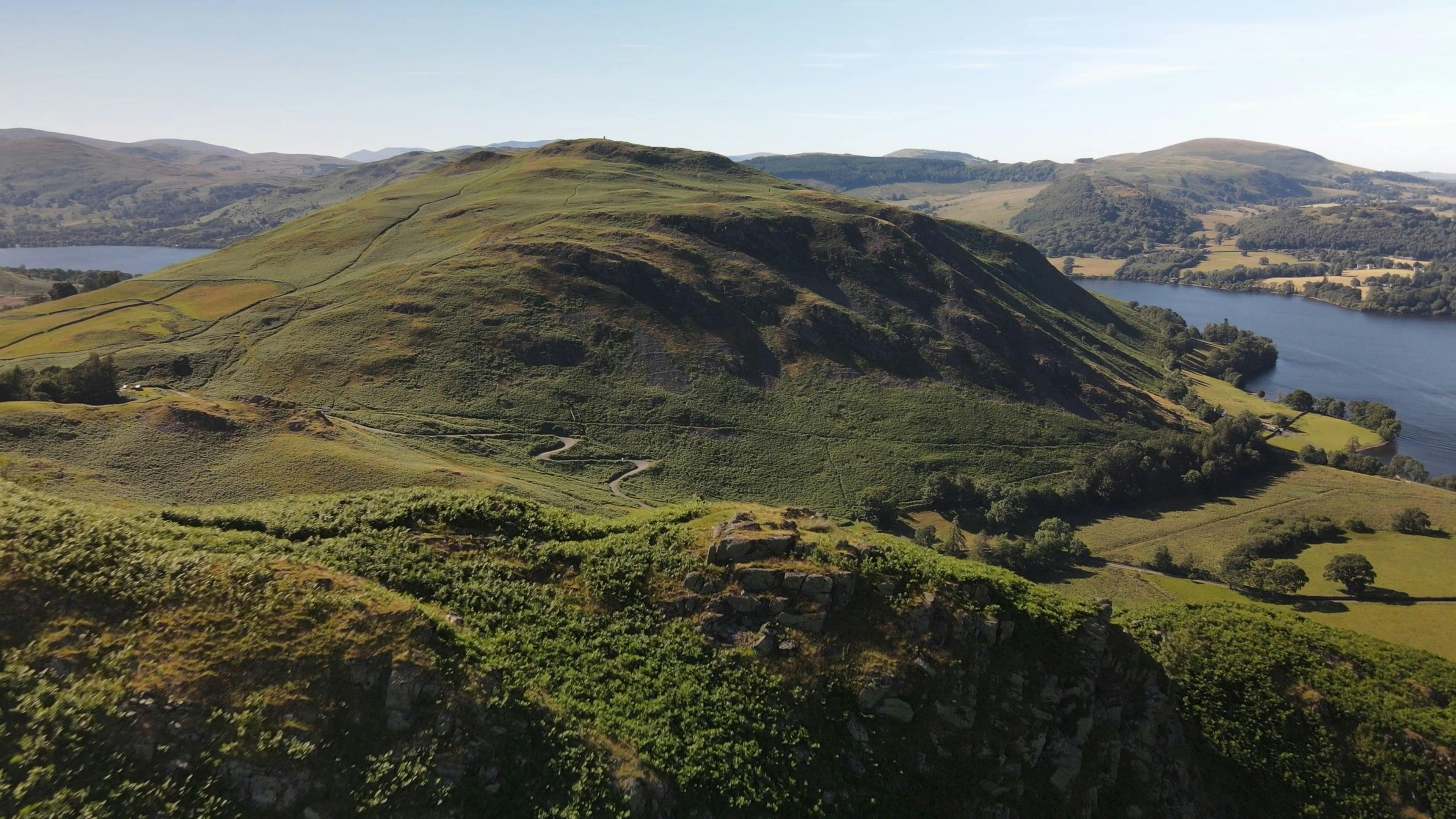 The view from the top of a hill overlooking a lake Free Stock Video ...