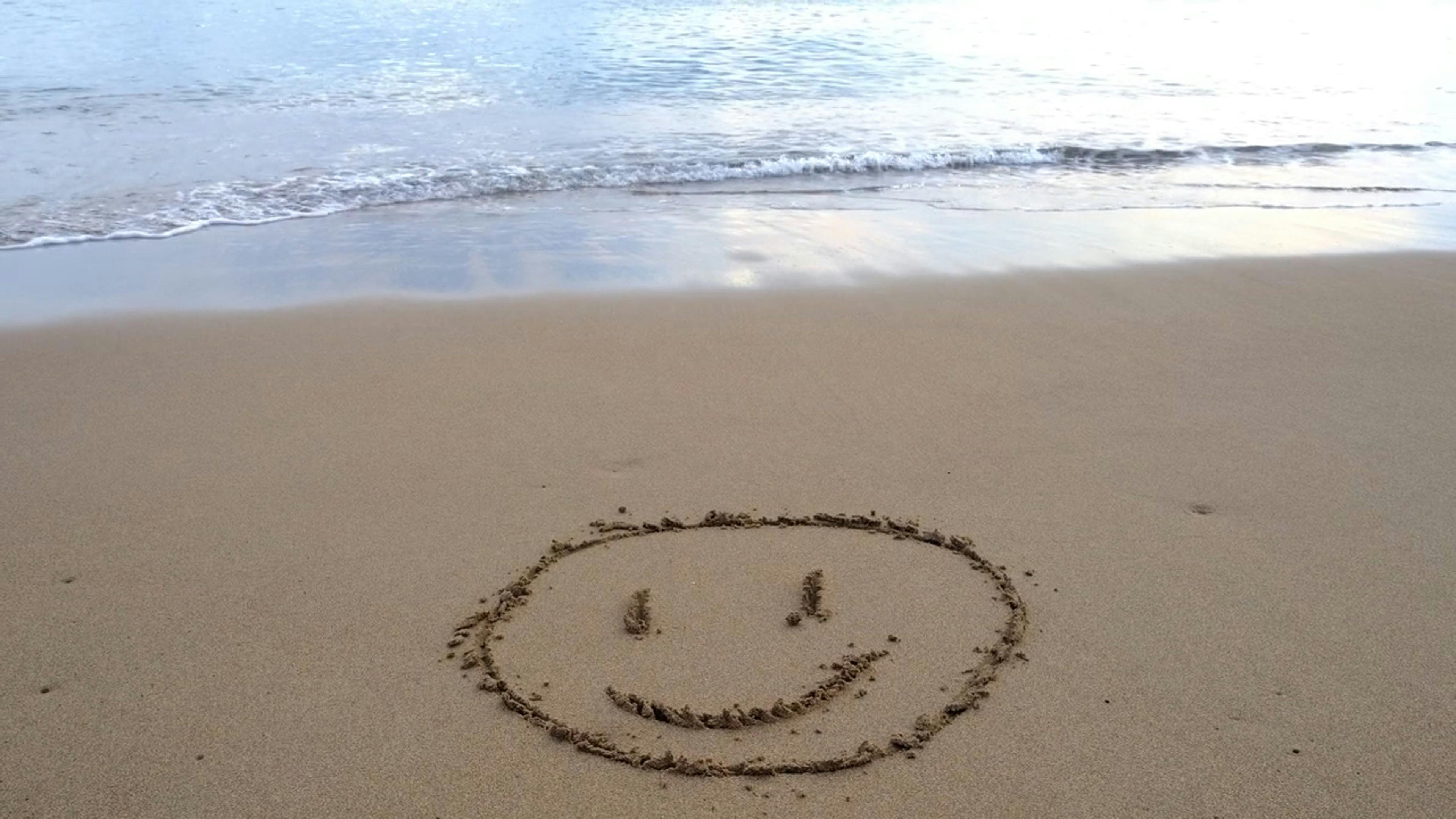 A Smiley Face Drawn on a Sandy Beach Free Stock Video Footage, Royalty ...