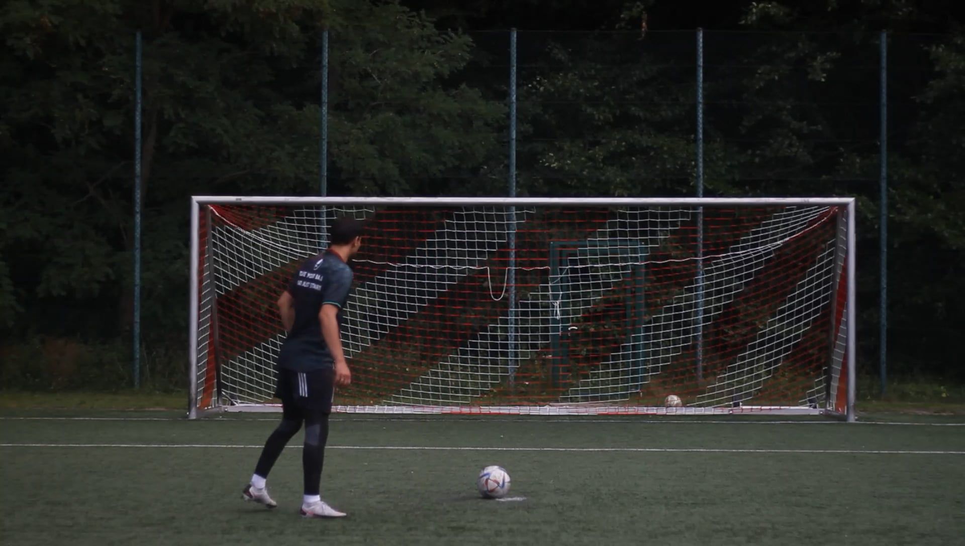 A Footballer Practising Penalty Kicks and Performing Tricks with the ...