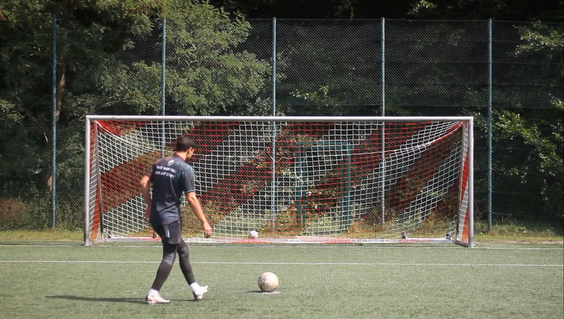 Back View of a Football Player Practising Penalty Kicks Free Stock ...