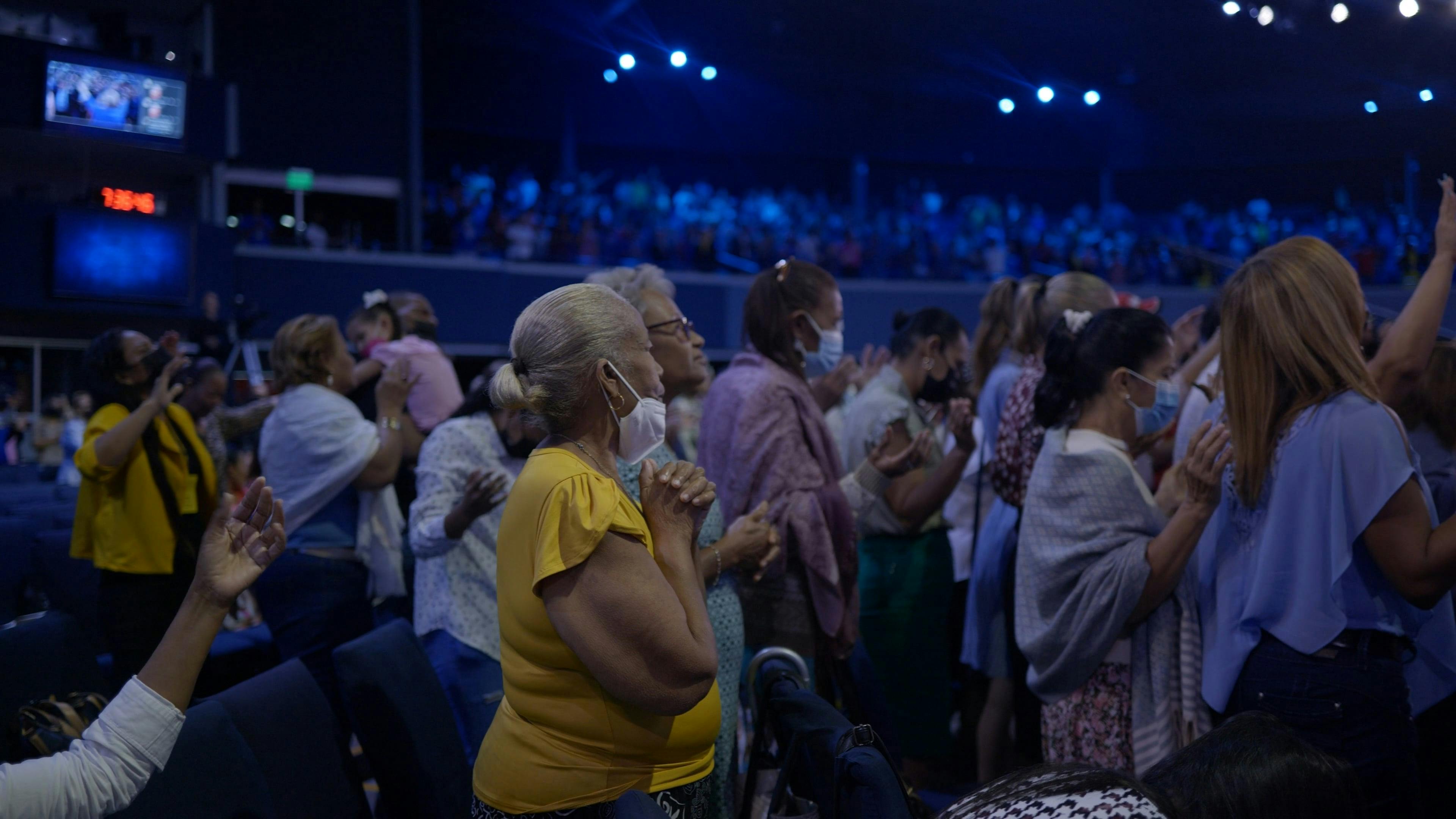 People are standing in a large crowd at a church Free Stock Video ...