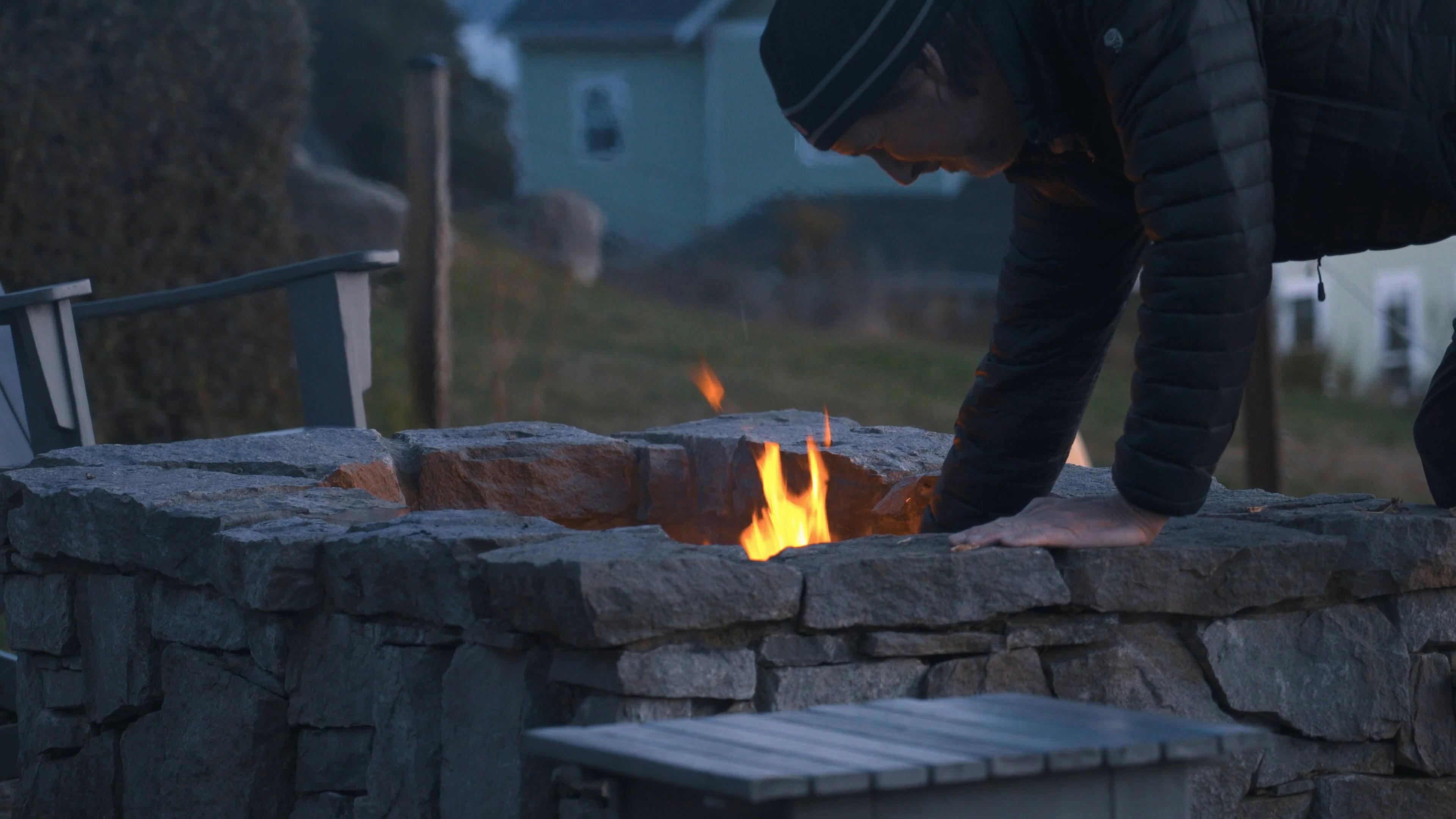 A Man Adding Kindling to a Fire Pit Free Stock Video Footage, Royalty ...