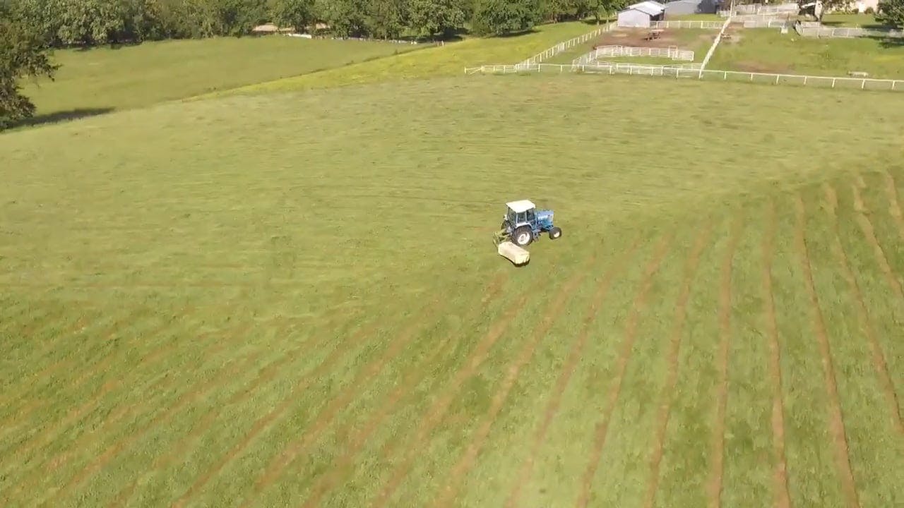 Cleaning The Field Using A Tractor · Free Stock Video
