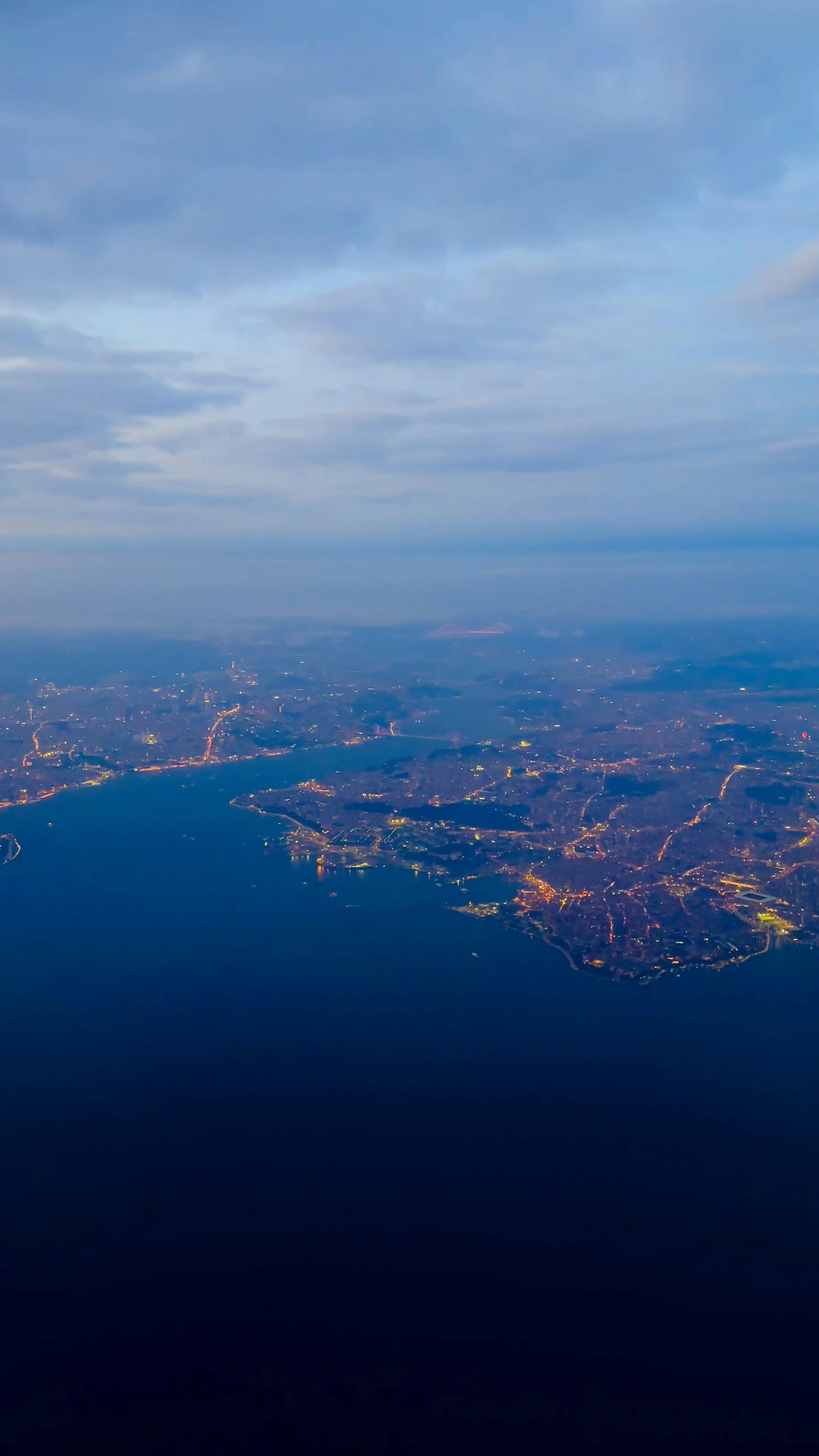 A Coastal City Seen from a Plane Window at Dawn Free Stock Video ...