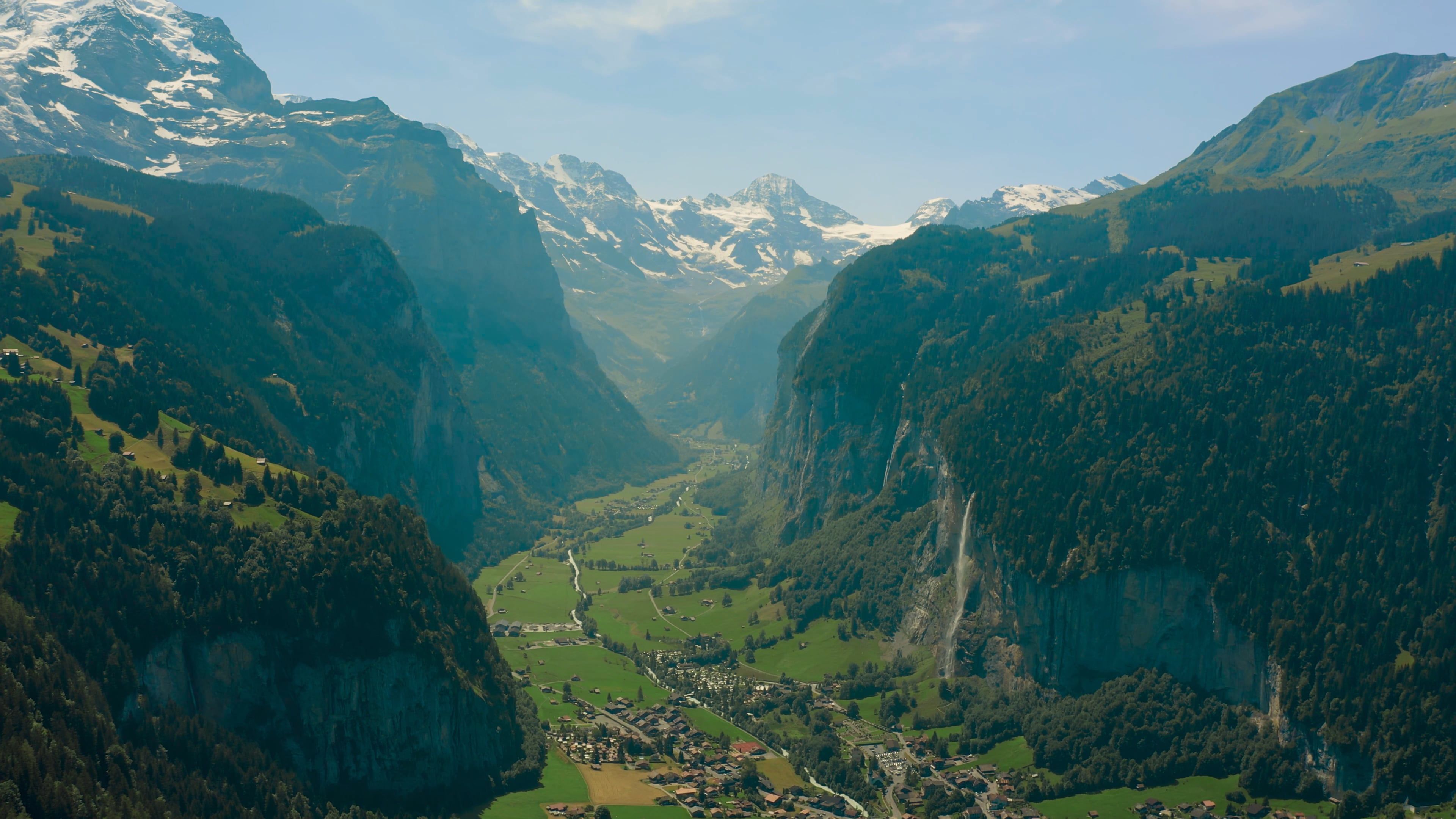 A valley with mountains and a river running through it Free Stock Video ...