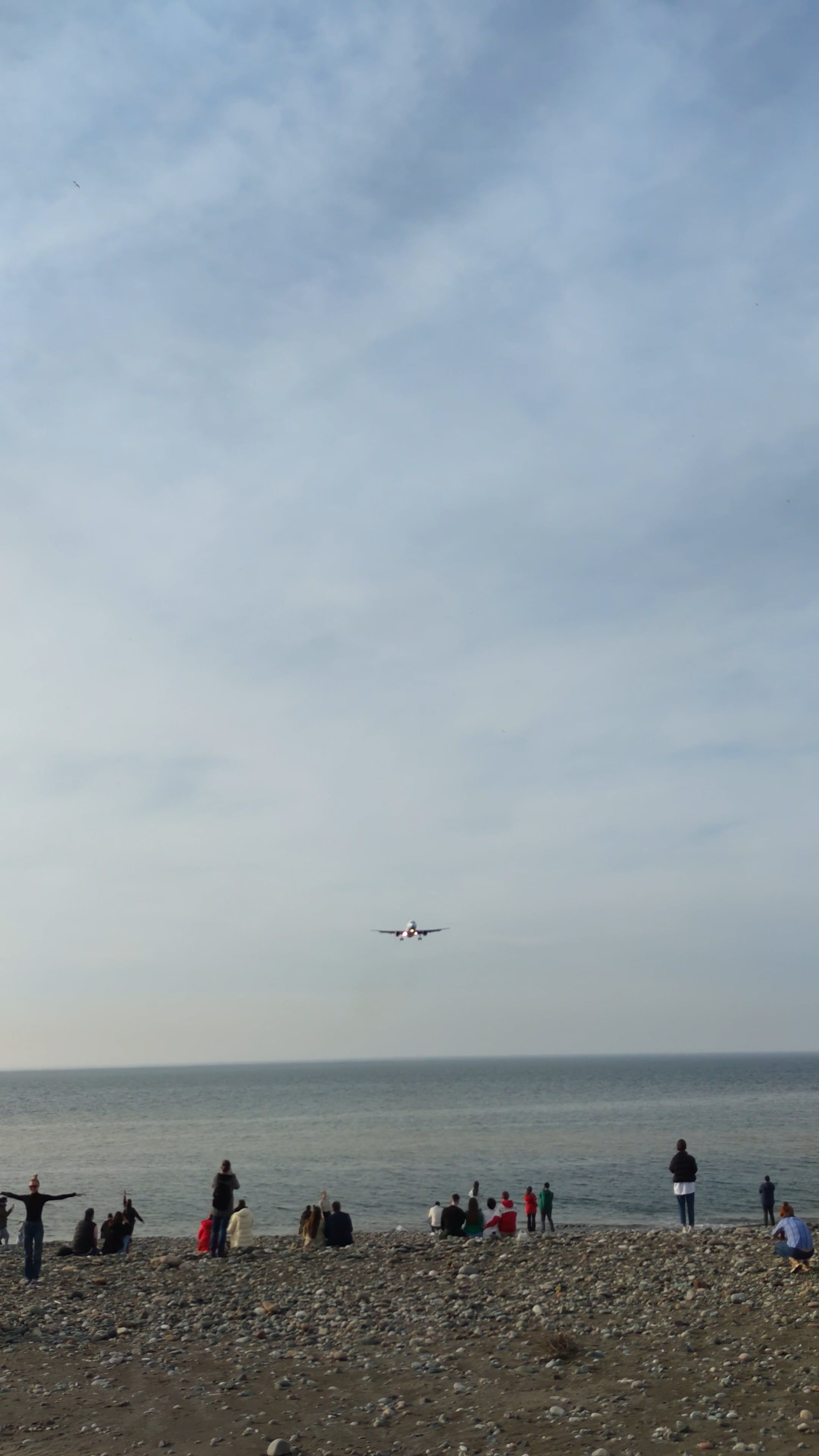 A Plane Flying at Low Altitude over the Beach Free Stock Video Footage ...