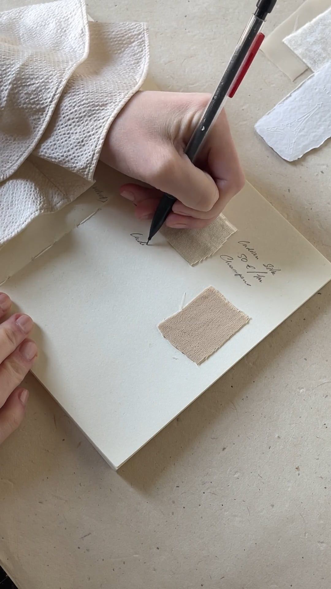 A Person Labeling Fabric Samples on a Swatch Book Free Stock Video ...