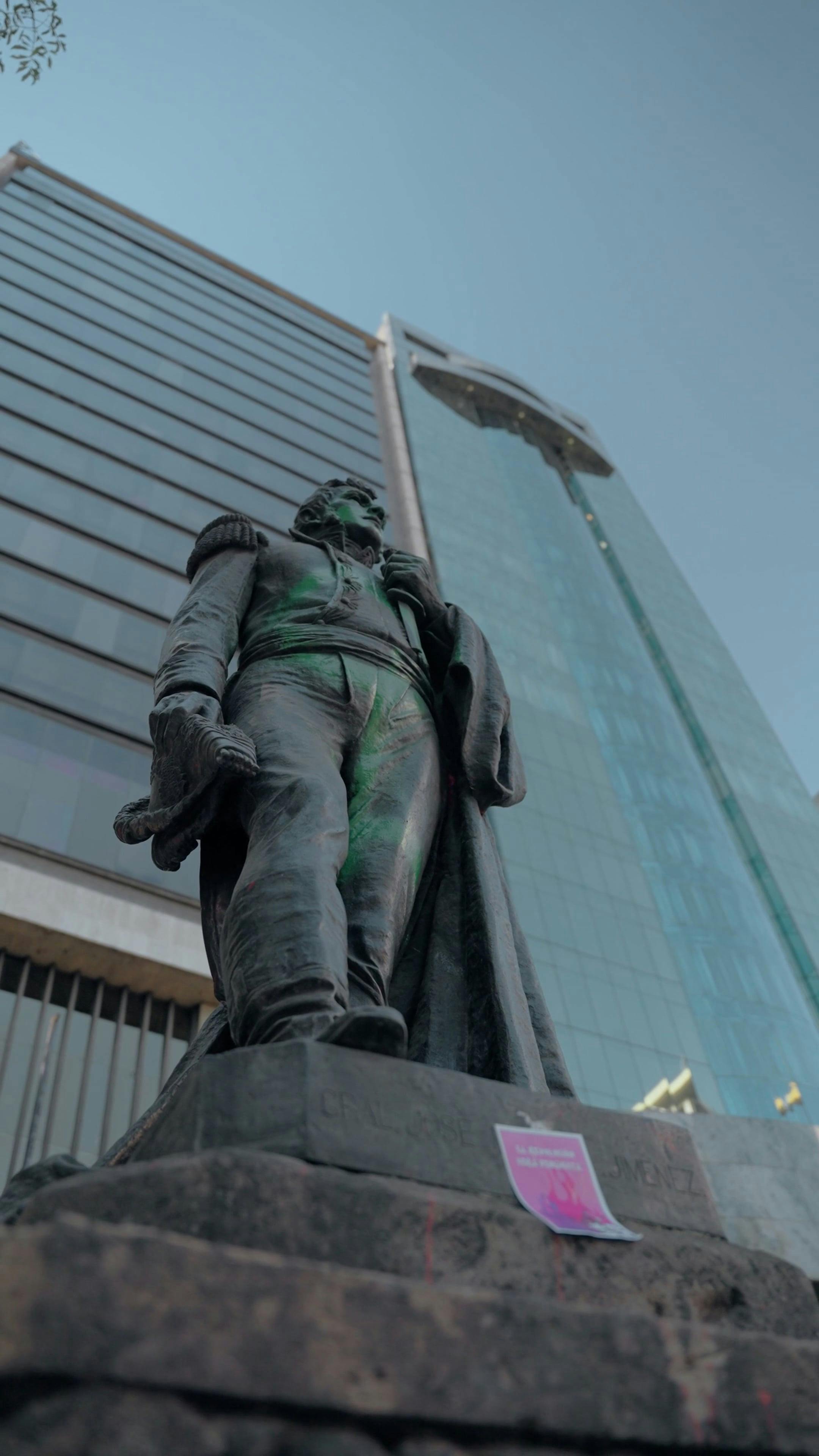A statue of a man in front of a tall building Free Stock Video Footage ...