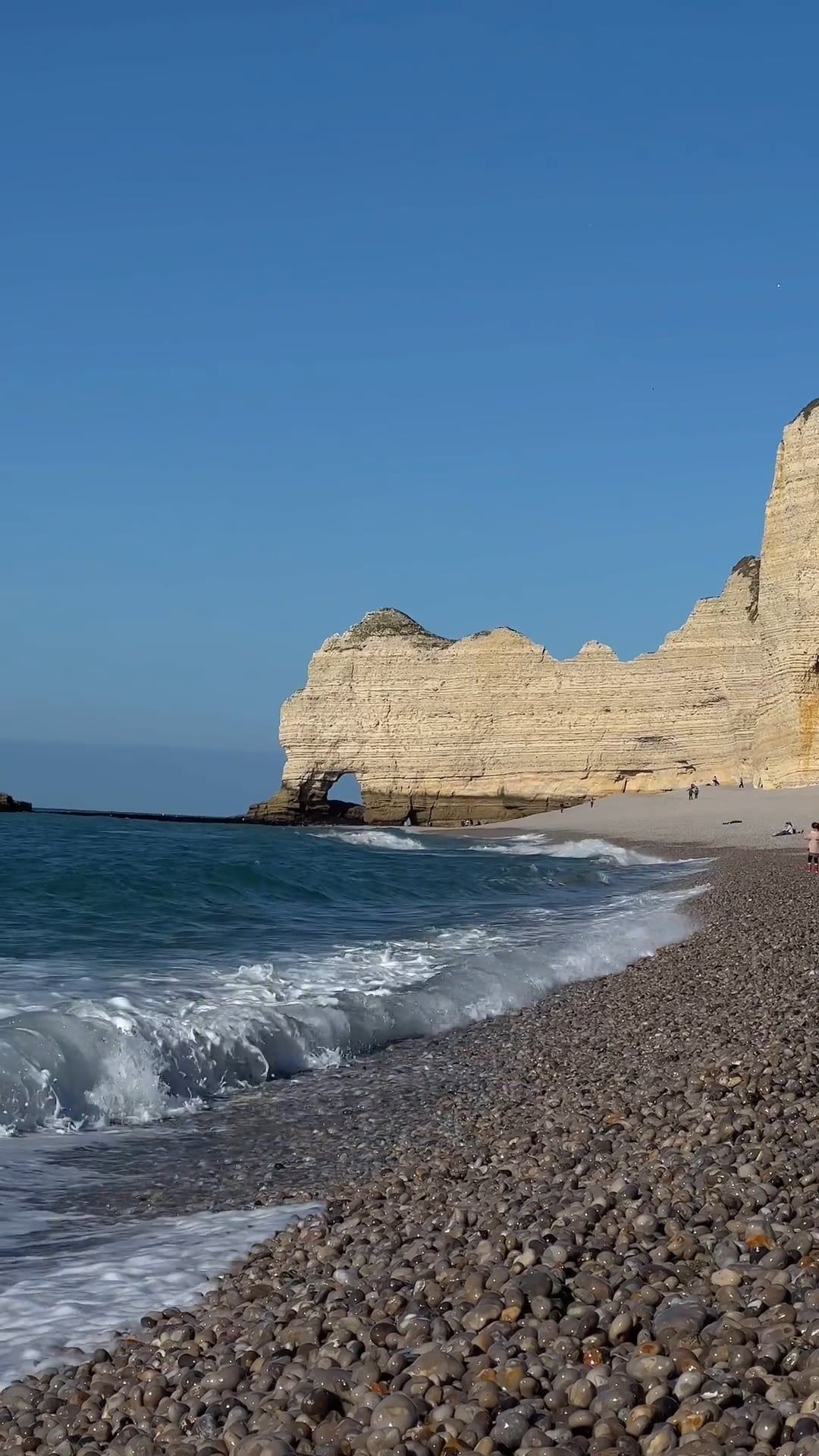 A beach with a rocky shore and a cliff Free Stock Video Footage ...