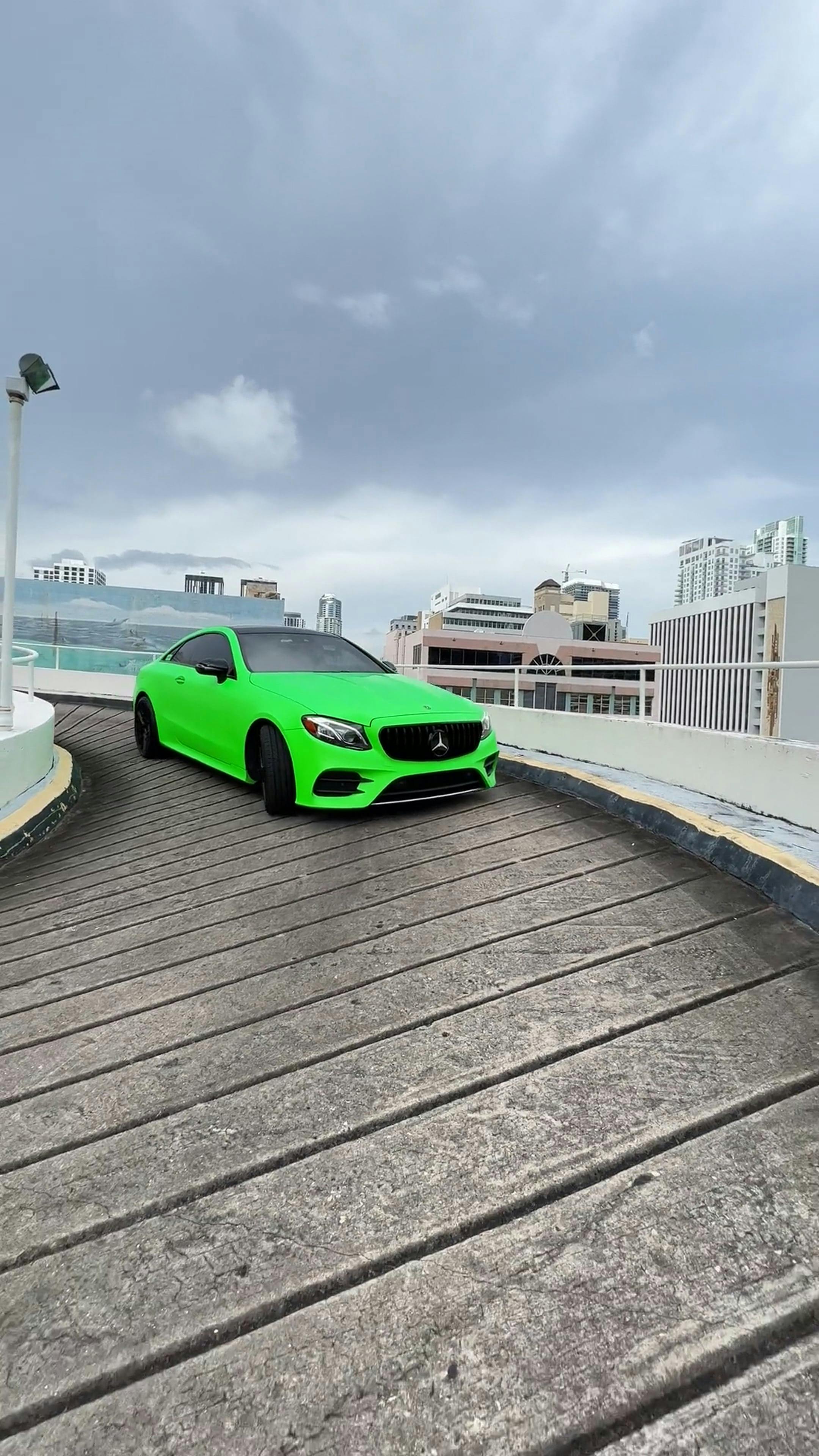 A Green Mercedes Benz Driving on a Parking Garage Ramp Free Stock Video ...