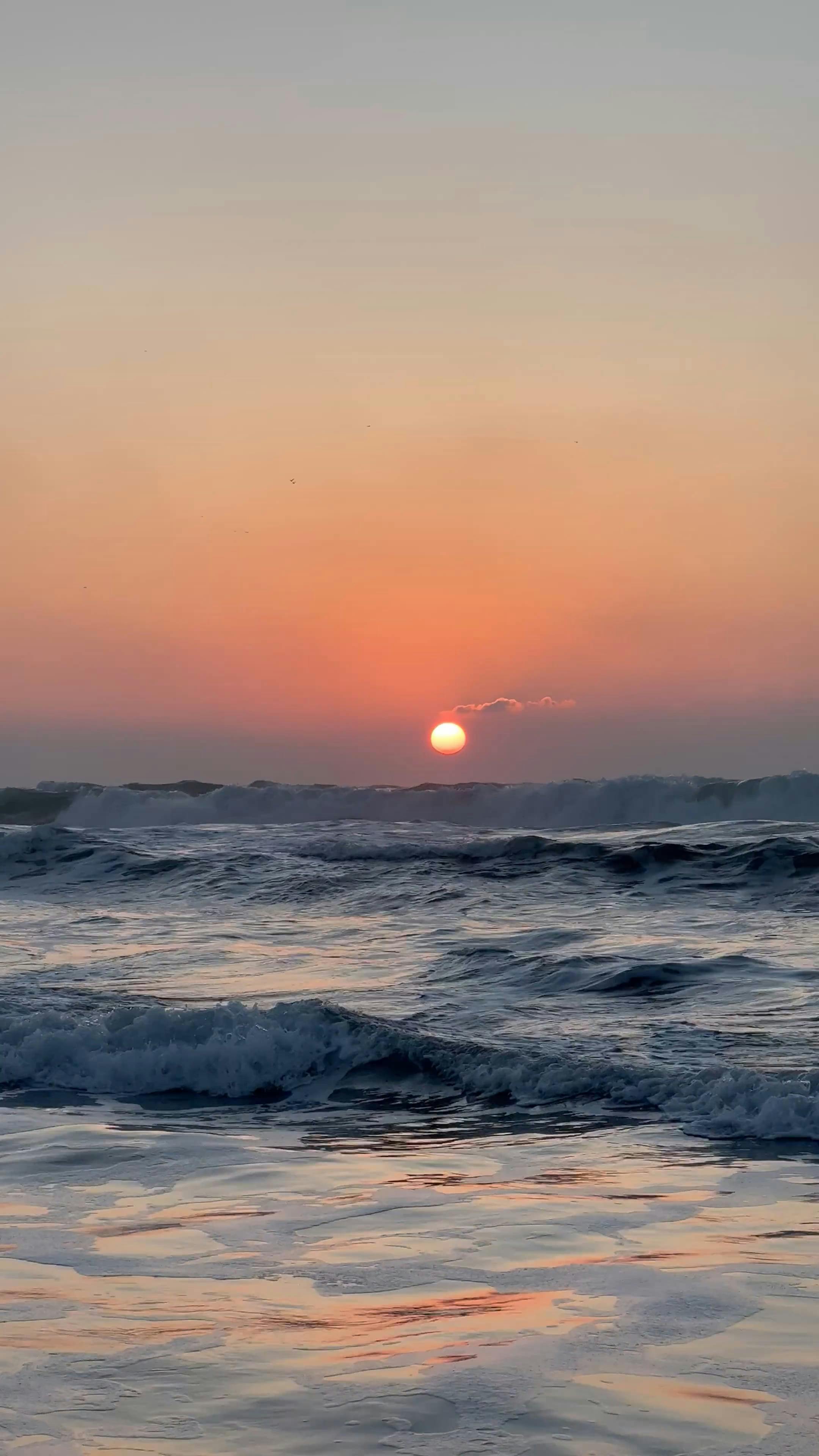 The sun is setting over the ocean with waves Free Stock Video Footage ...