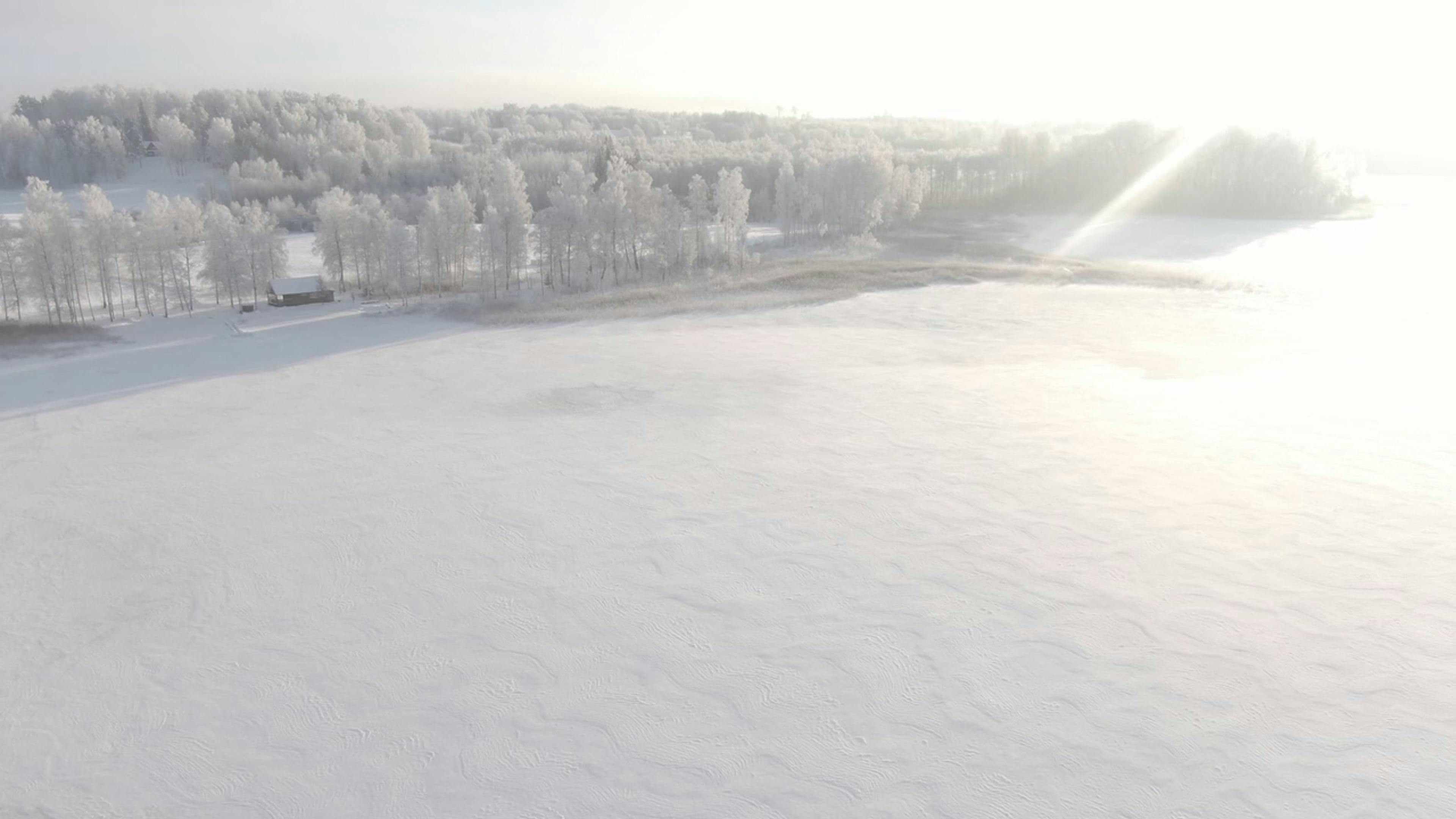 Drone Footage of a Cabin in a Vast Snow Covered Landscape Free Stock ...