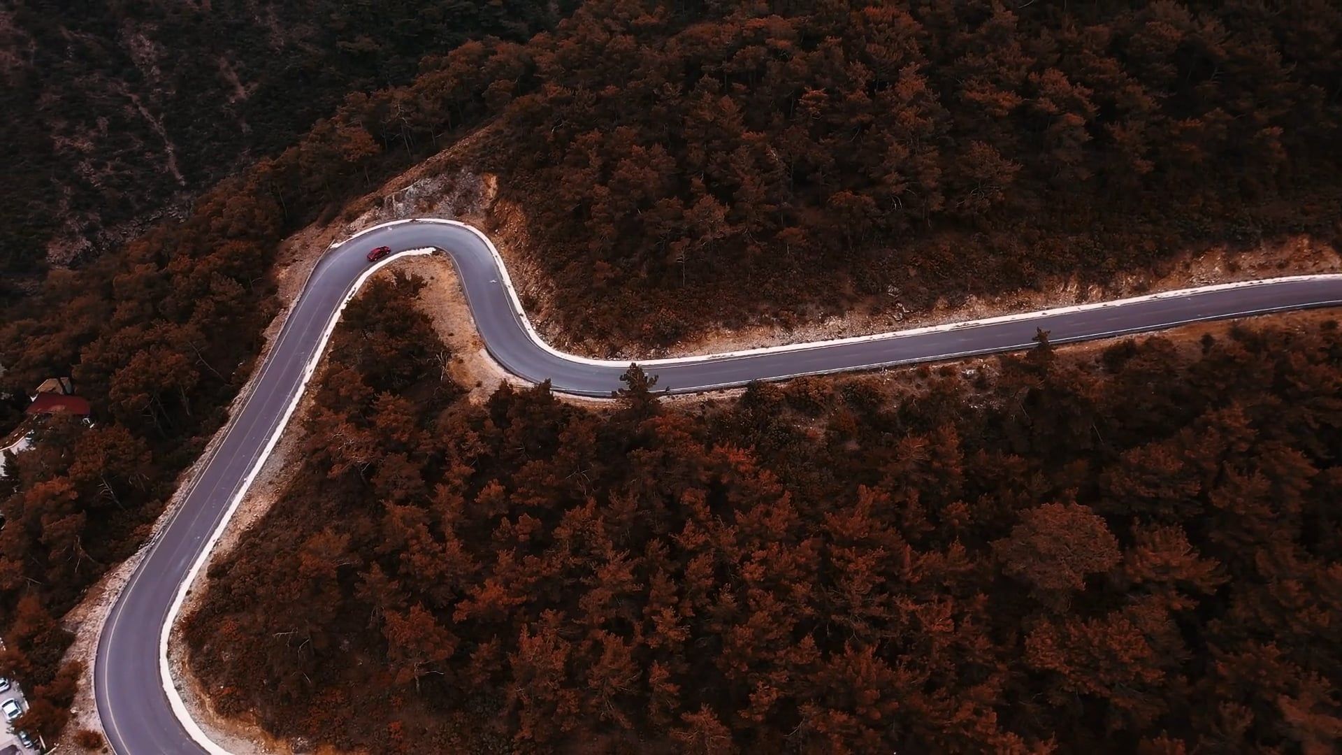 An aerial view of a winding road in the mountains Free Stock Video ...