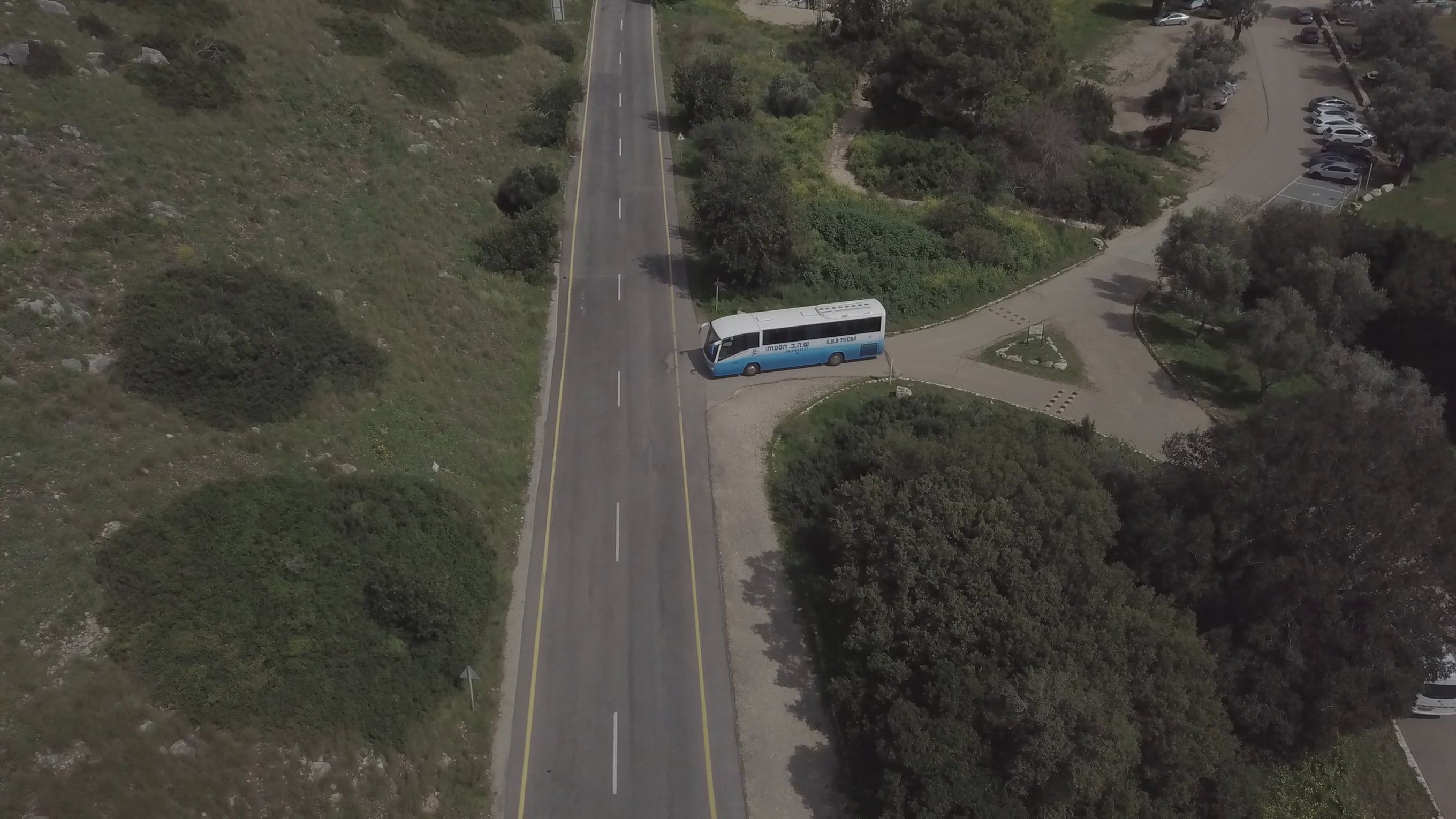 An aerial view of a bus driving down a road Free Stock Video Footage ...