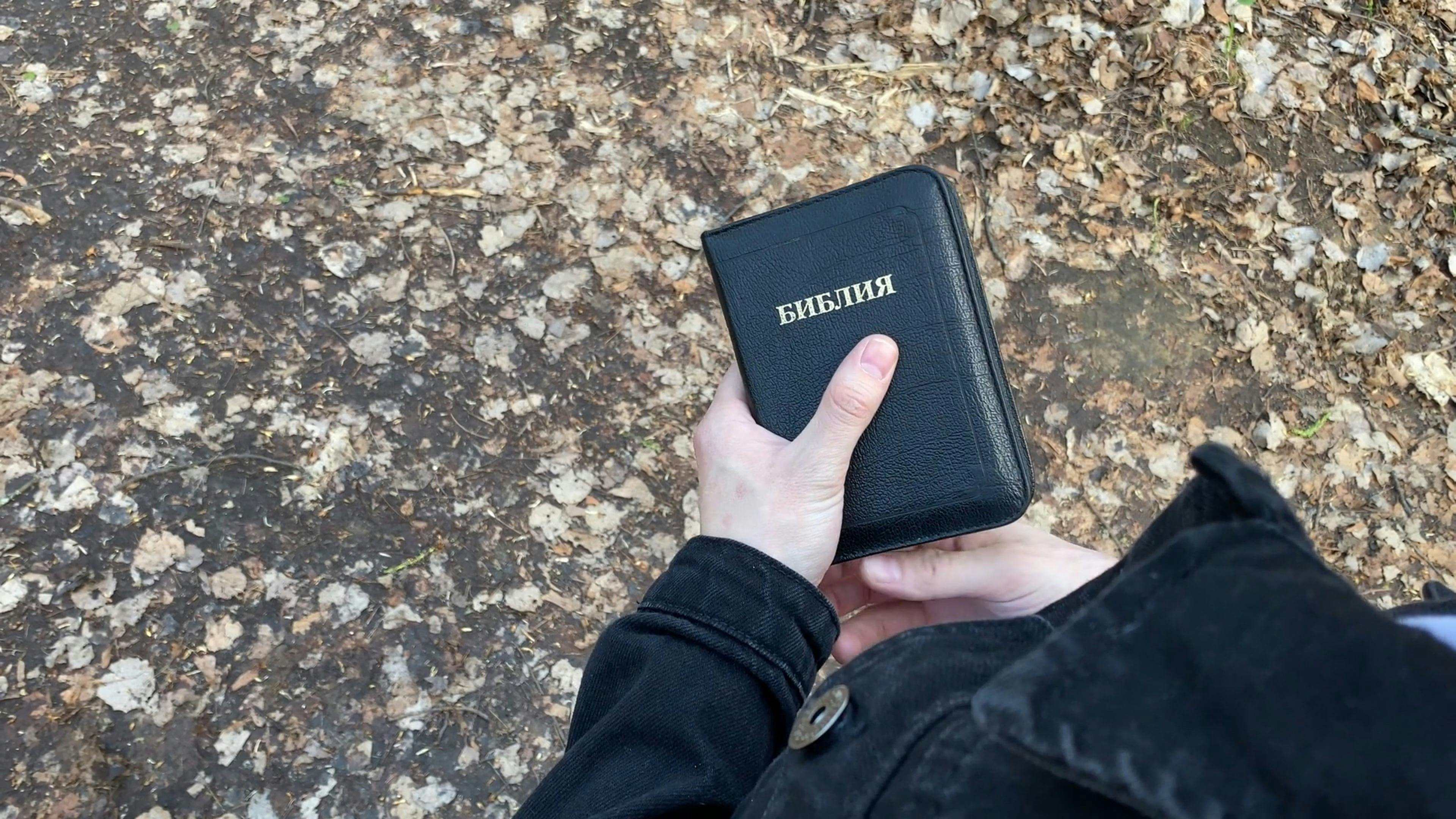High Angle View of a Person Opening a Bible Free Stock Video Footage ...