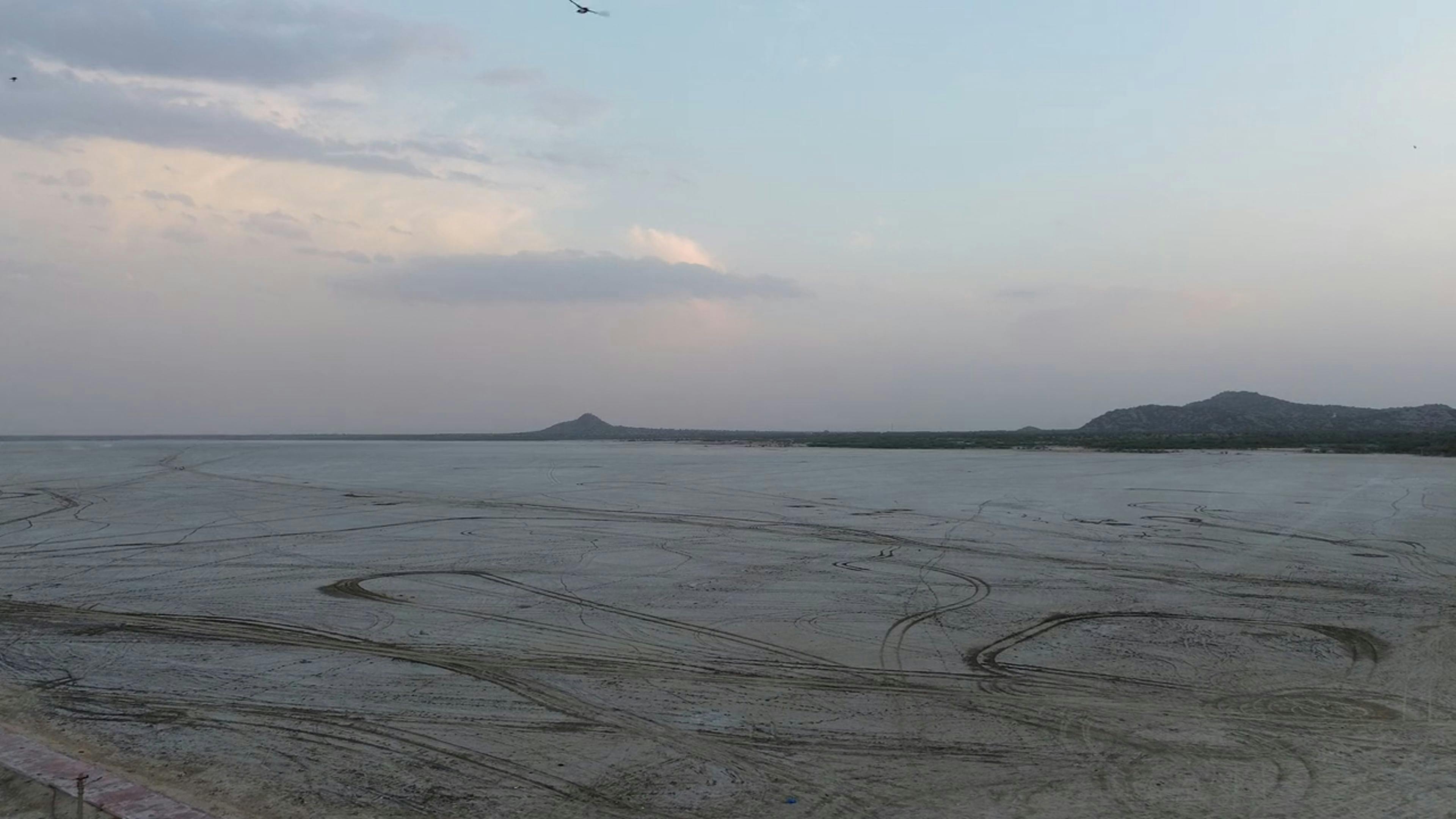 A large empty field with a few trees in the distance Free Stock Video ...
