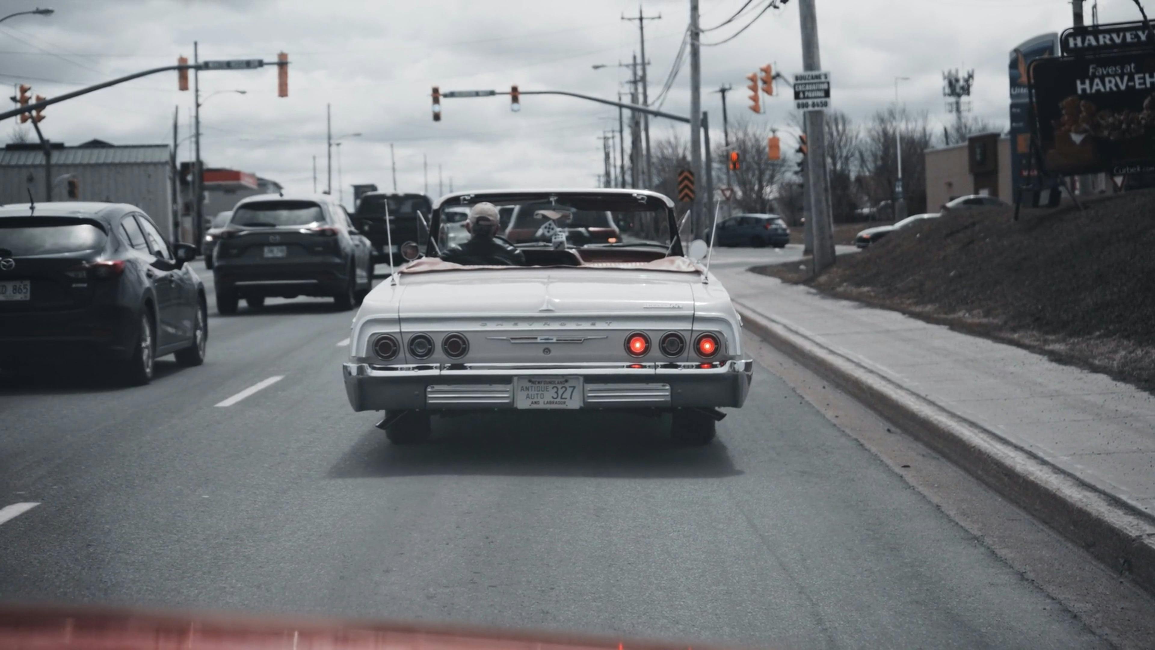 A car driving down the road with traffic lights Free Stock Video ...