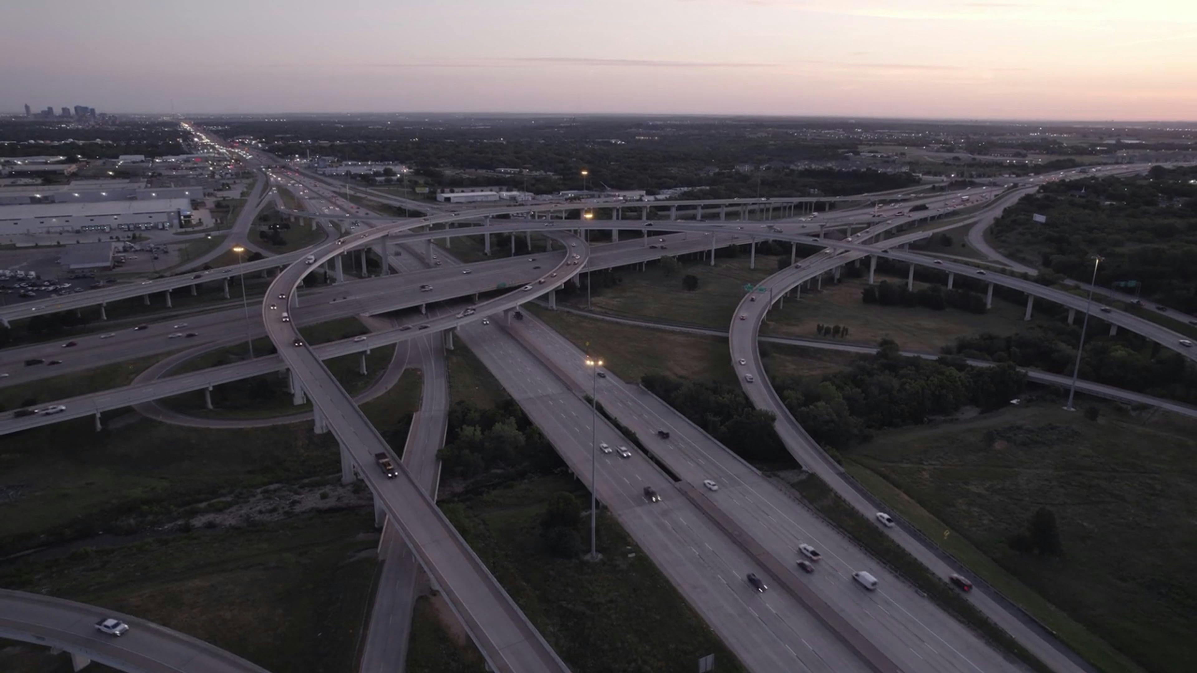 An aerial view of a highway intersection at dusk Free Stock Video ...
