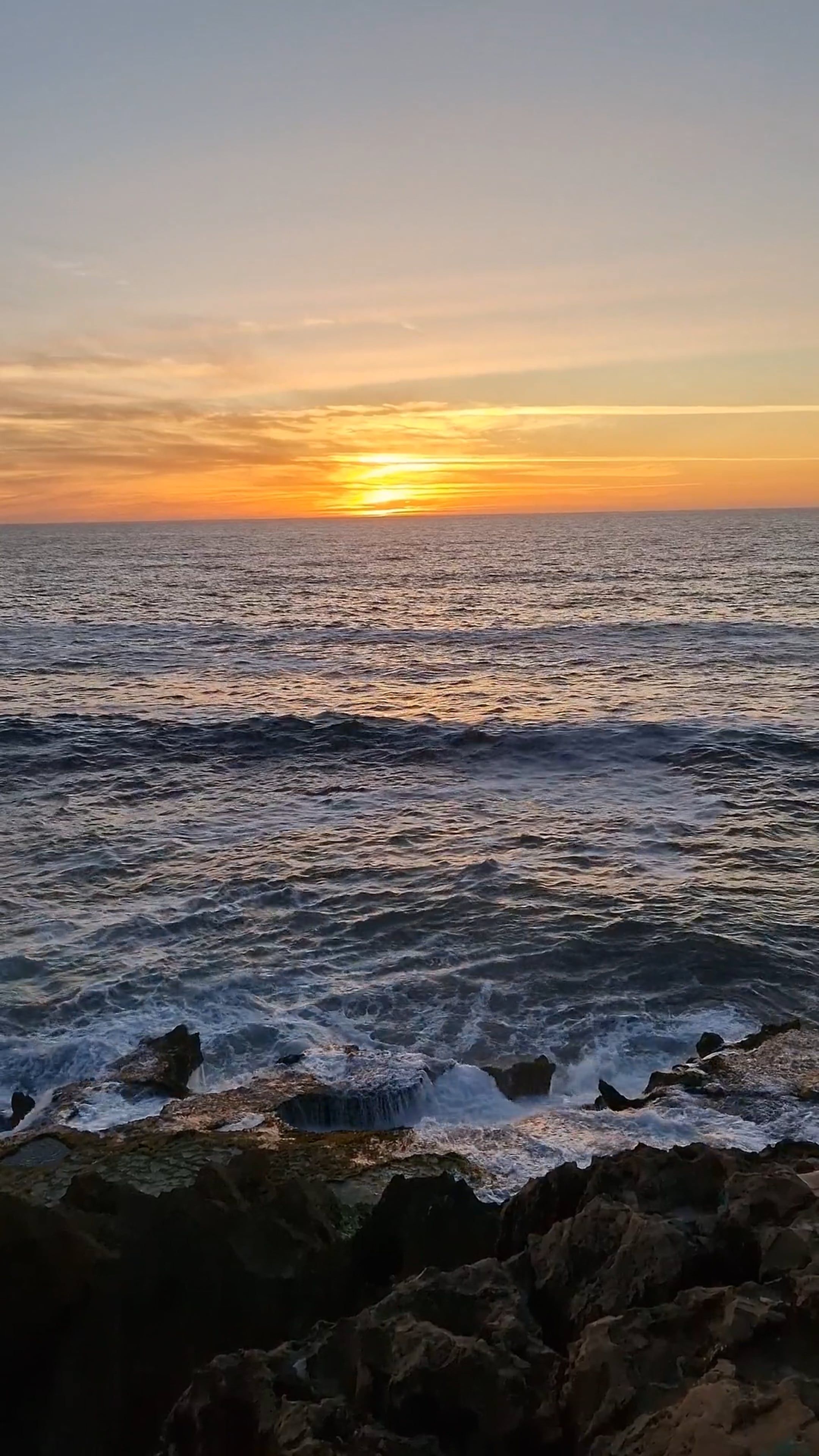 A sunset over the ocean with waves crashing Free Stock Video Footage ...