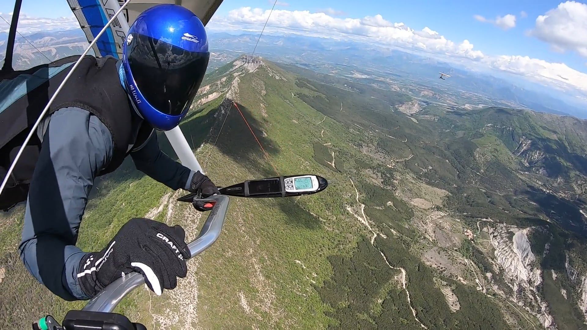 A person is flying a paraglider over a mountain Free Stock Video ...