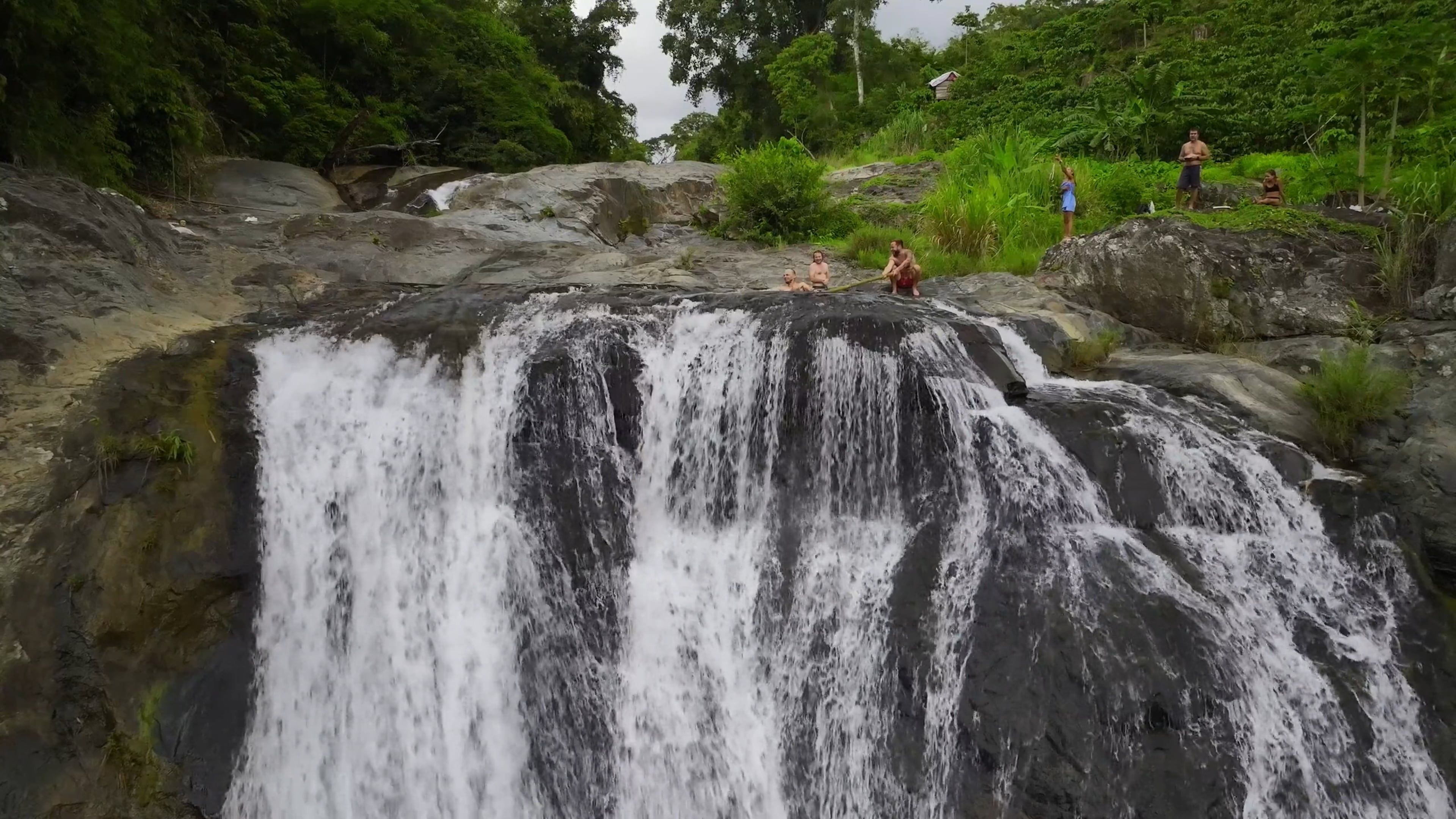 Friends Bathing at a Waterfall in a Tropical Forest Free Stock Video ...