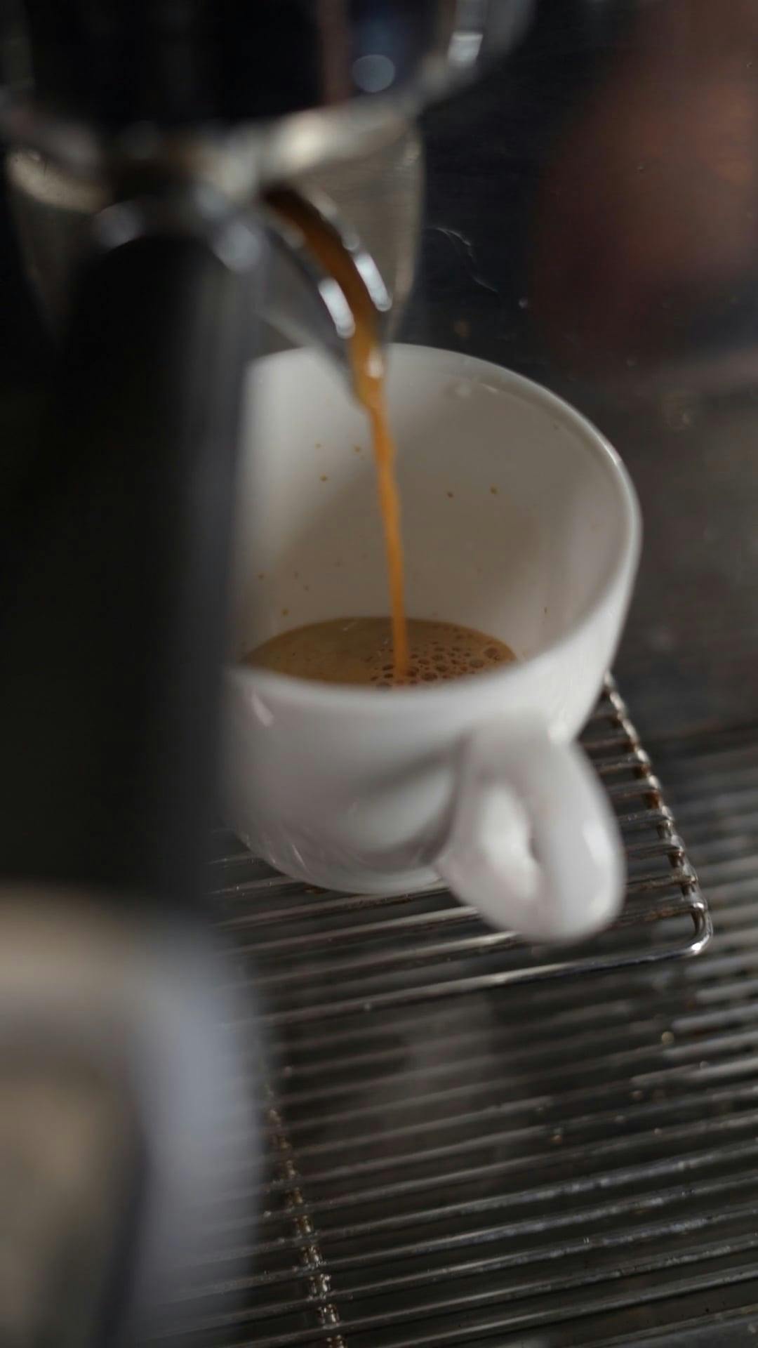 Slow Motion Footage Of Freshly Brewed Coffee Dripping Into A Cup Free ...