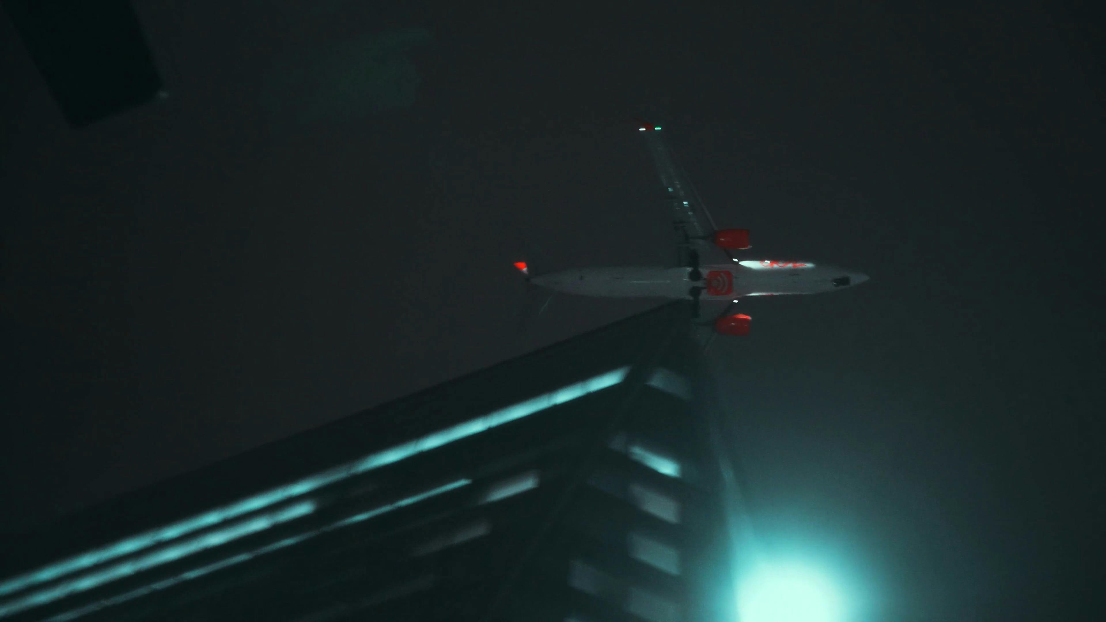 A plane flying over a city at night Free Stock Video Footage, Royalty ...