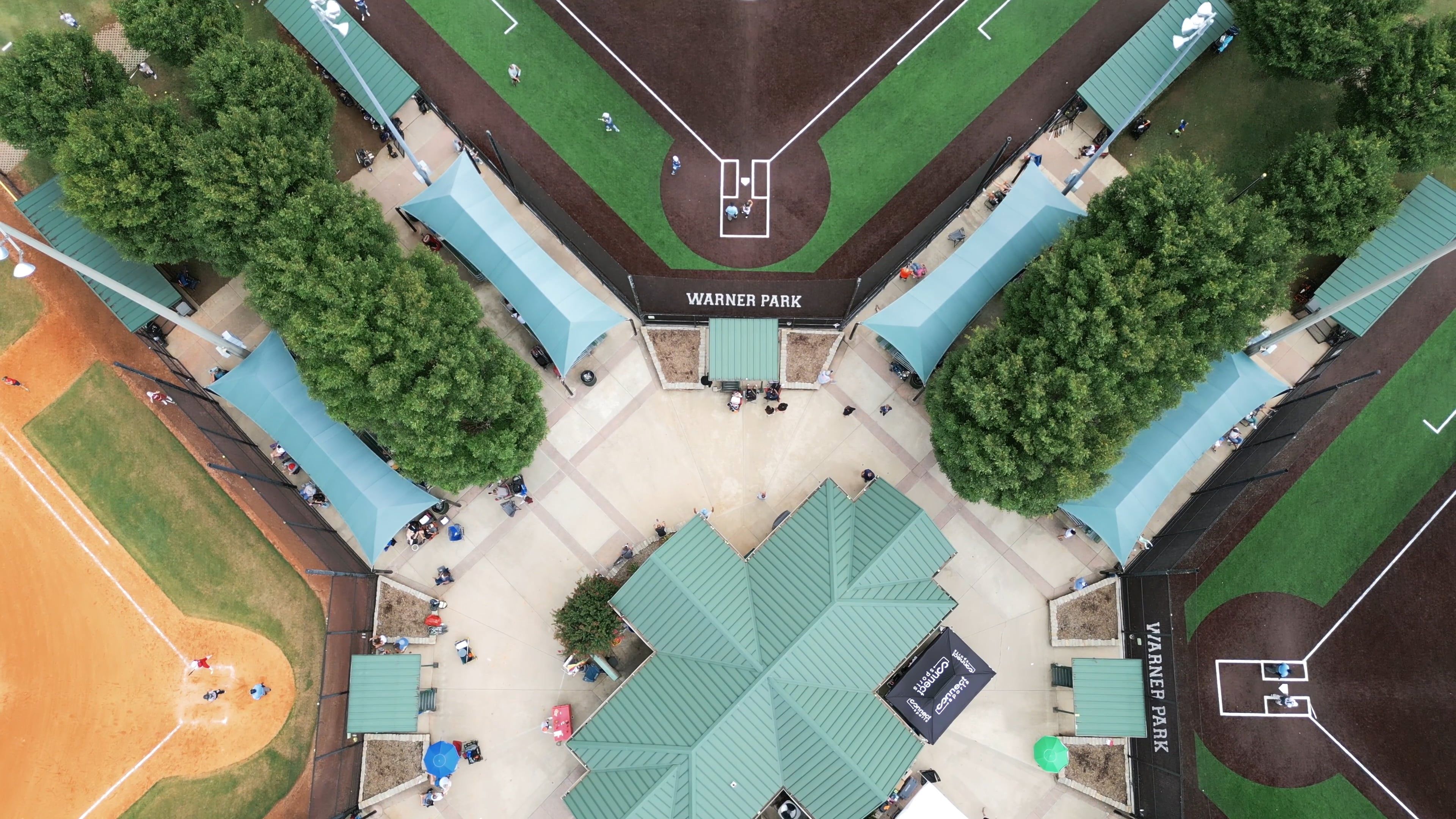 A baseball field with a green grass and trees Free Stock Video Footage ...