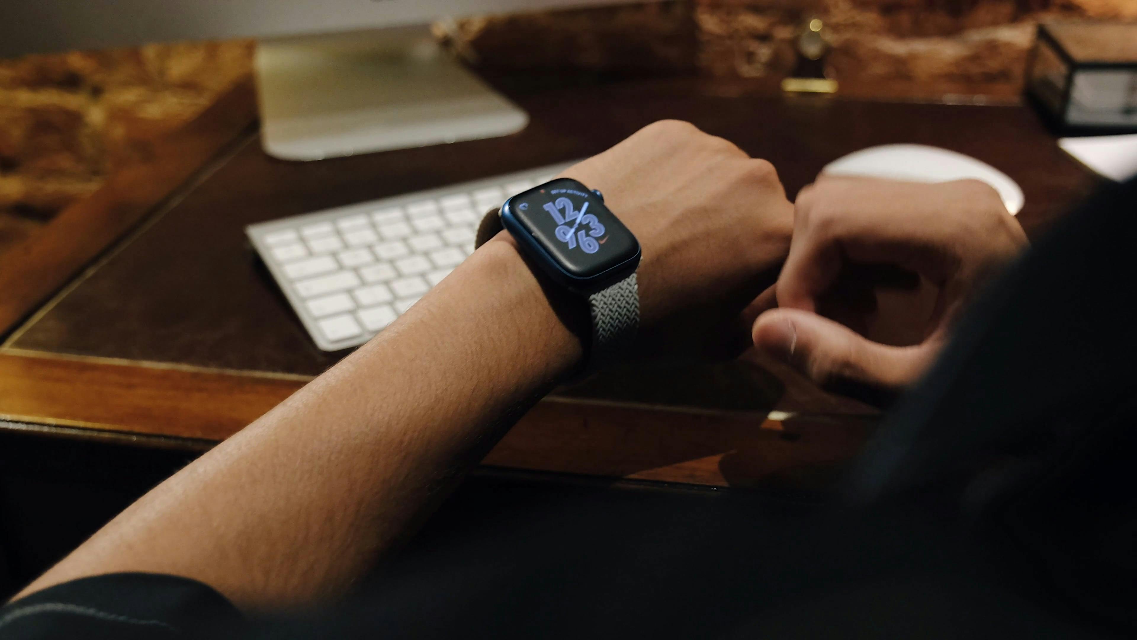 A person is using an apple watch on a desk Free Stock Video Footage ...