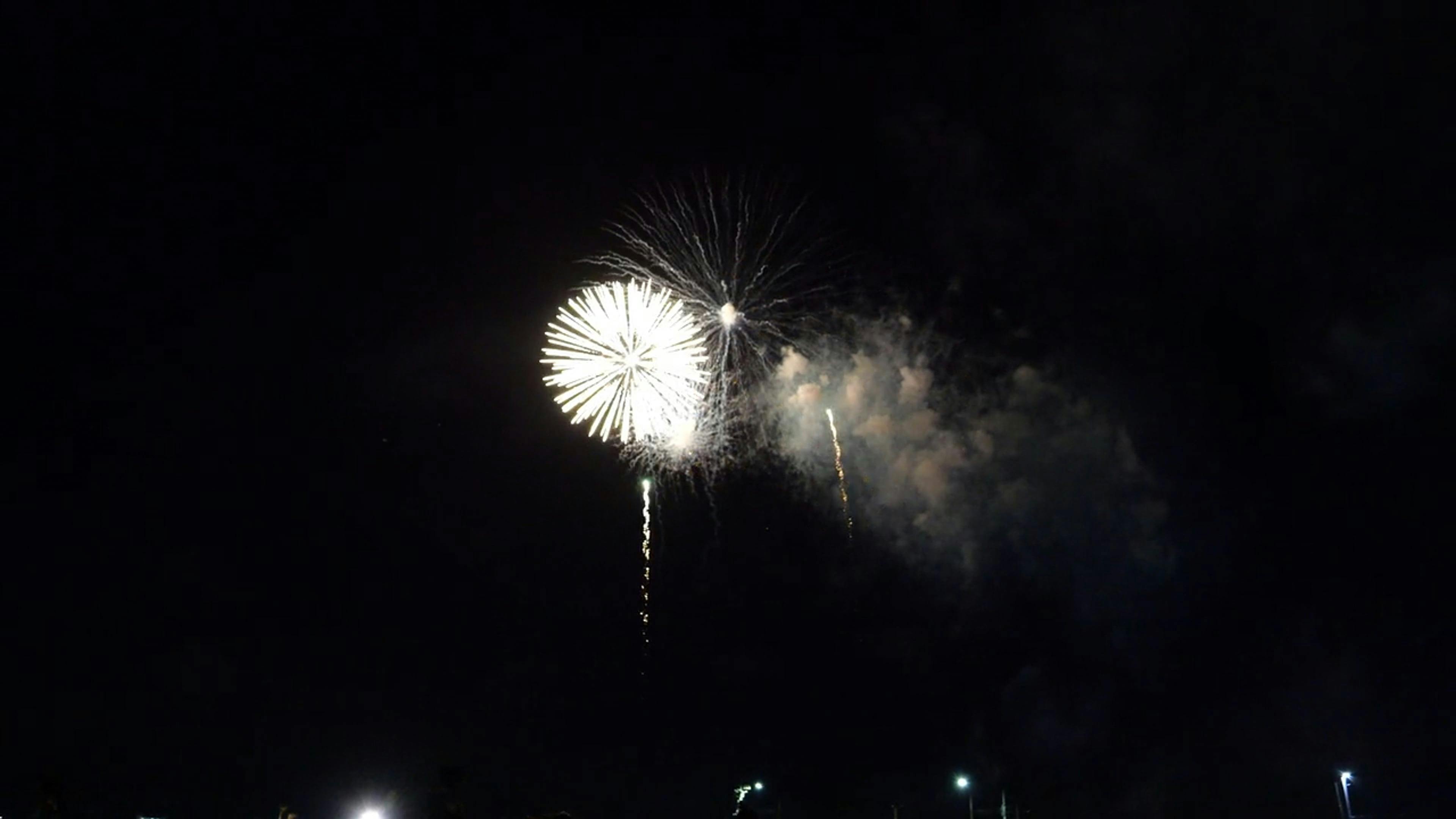 Fireworks explode over the water at night Free Stock Video Footage ...