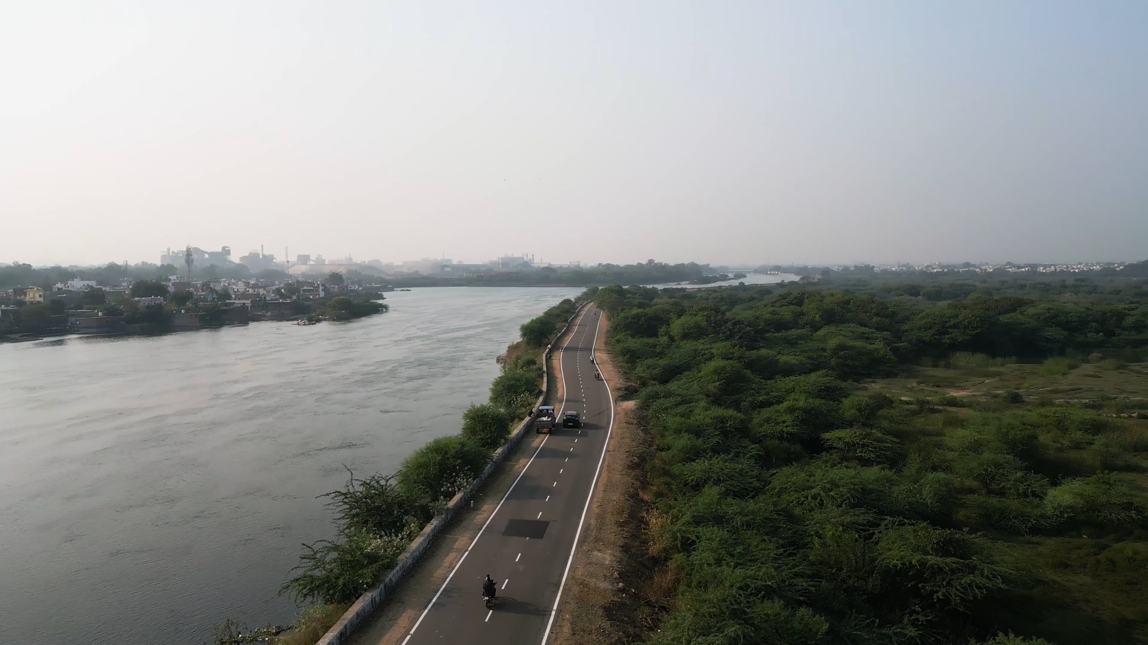 A road runs through a river and next to a highway Free Stock Video ...