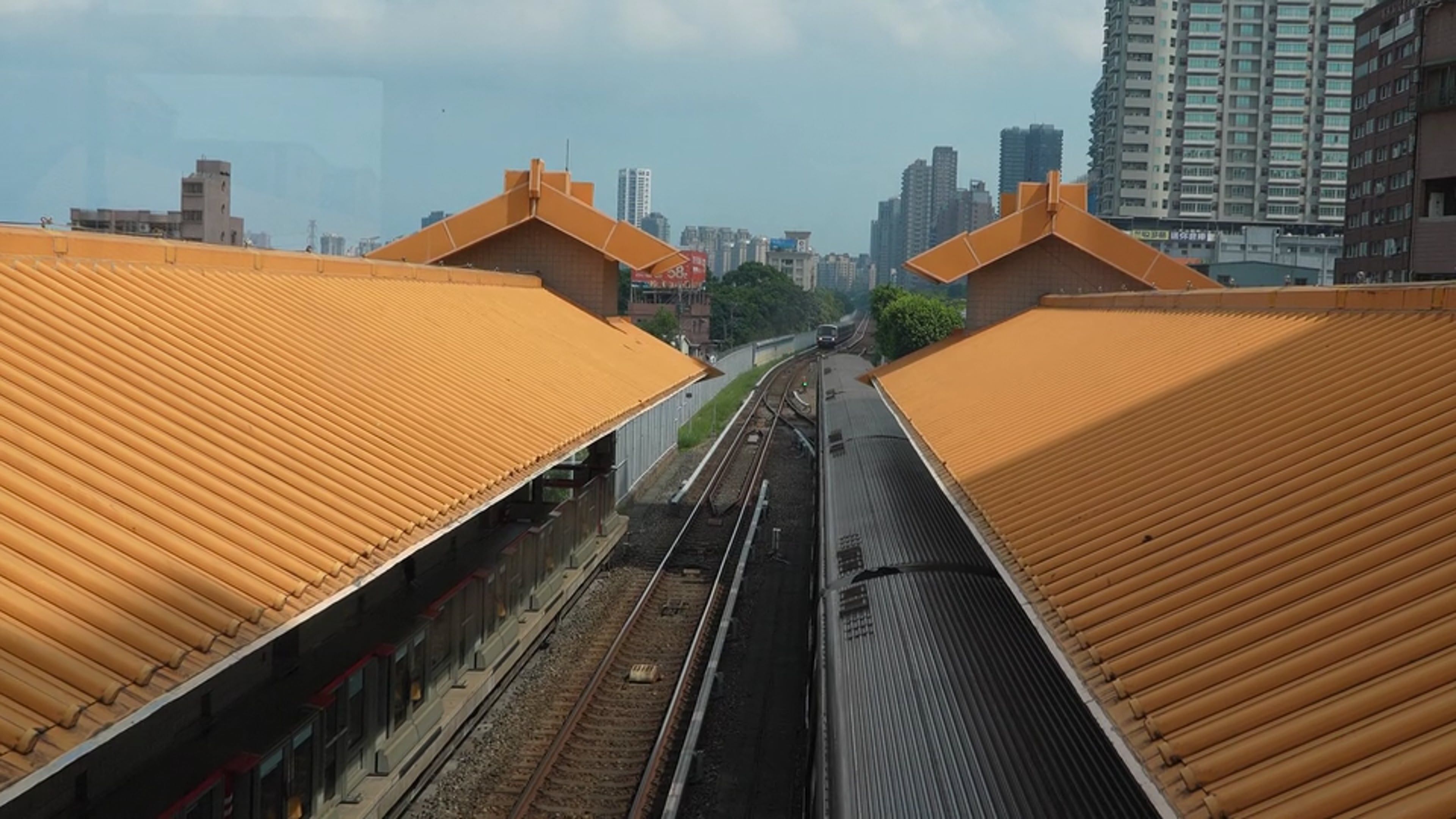 A train tracks with yellow roofs and buildings Free Stock Video Footage ...