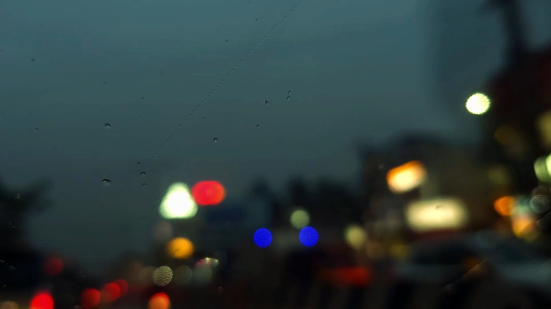Rain drops on the windshield of a car at night Free Stock Video Footage ...