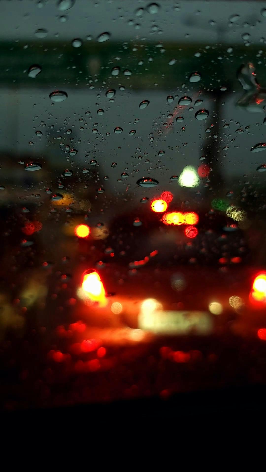A car with rain on the windshield and traffic lights Free Stock Video ...