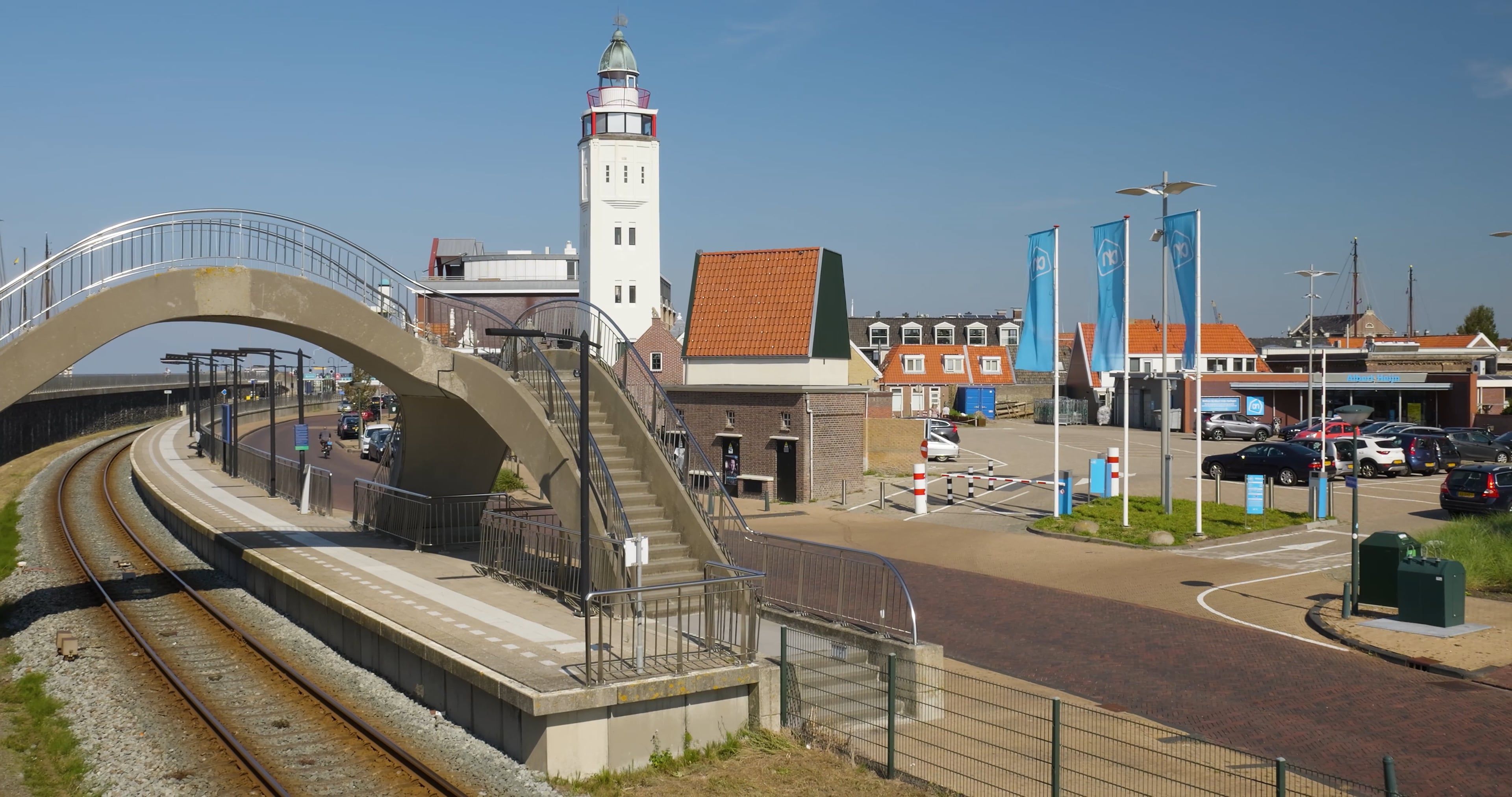 A train station with a bridge and a lighthouse Free Stock Video Footage ...