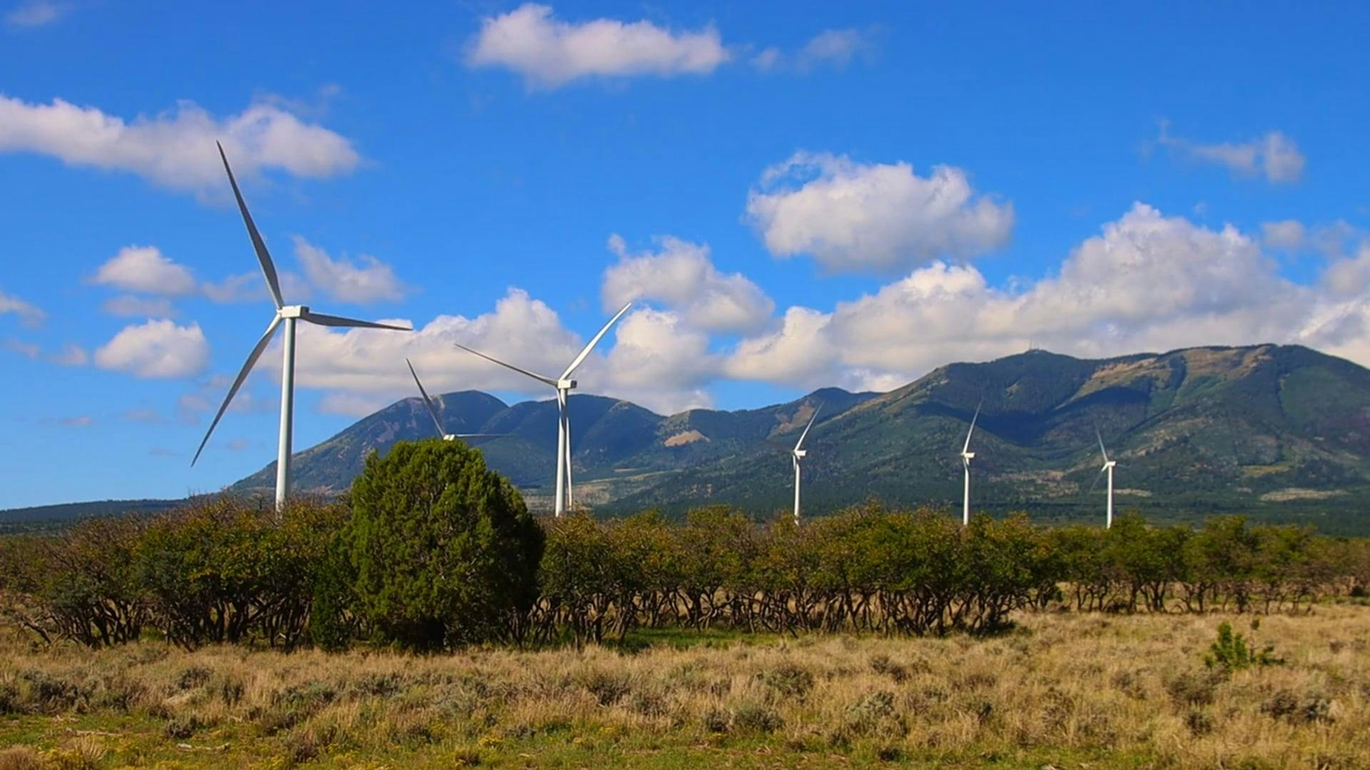 Slo-Mo Static Shot of Abajo Mountains and Electric Windmills Monticello ...