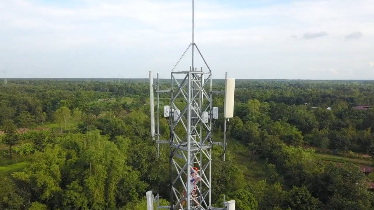 Man On A Tower Working On Power Lines · Free Stock Video