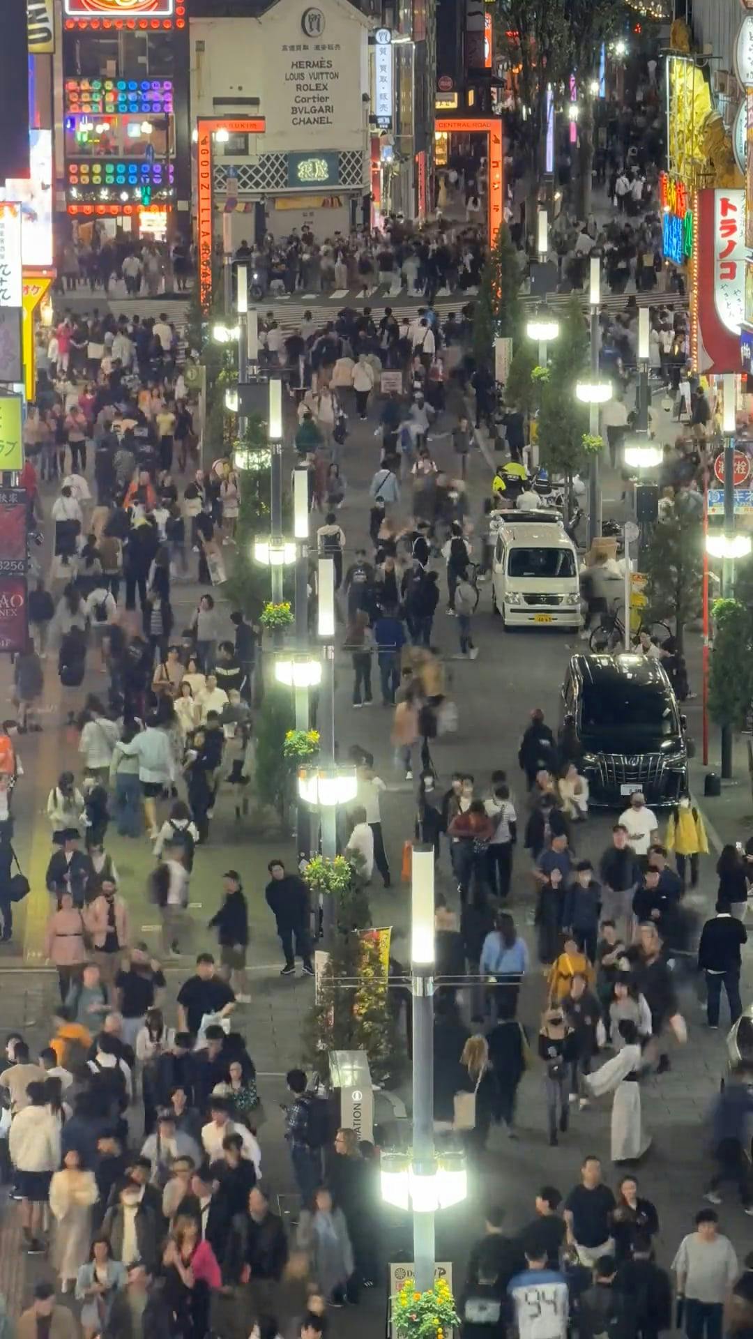 A crowded street with people walking and cars Free Stock Video Footage ...
