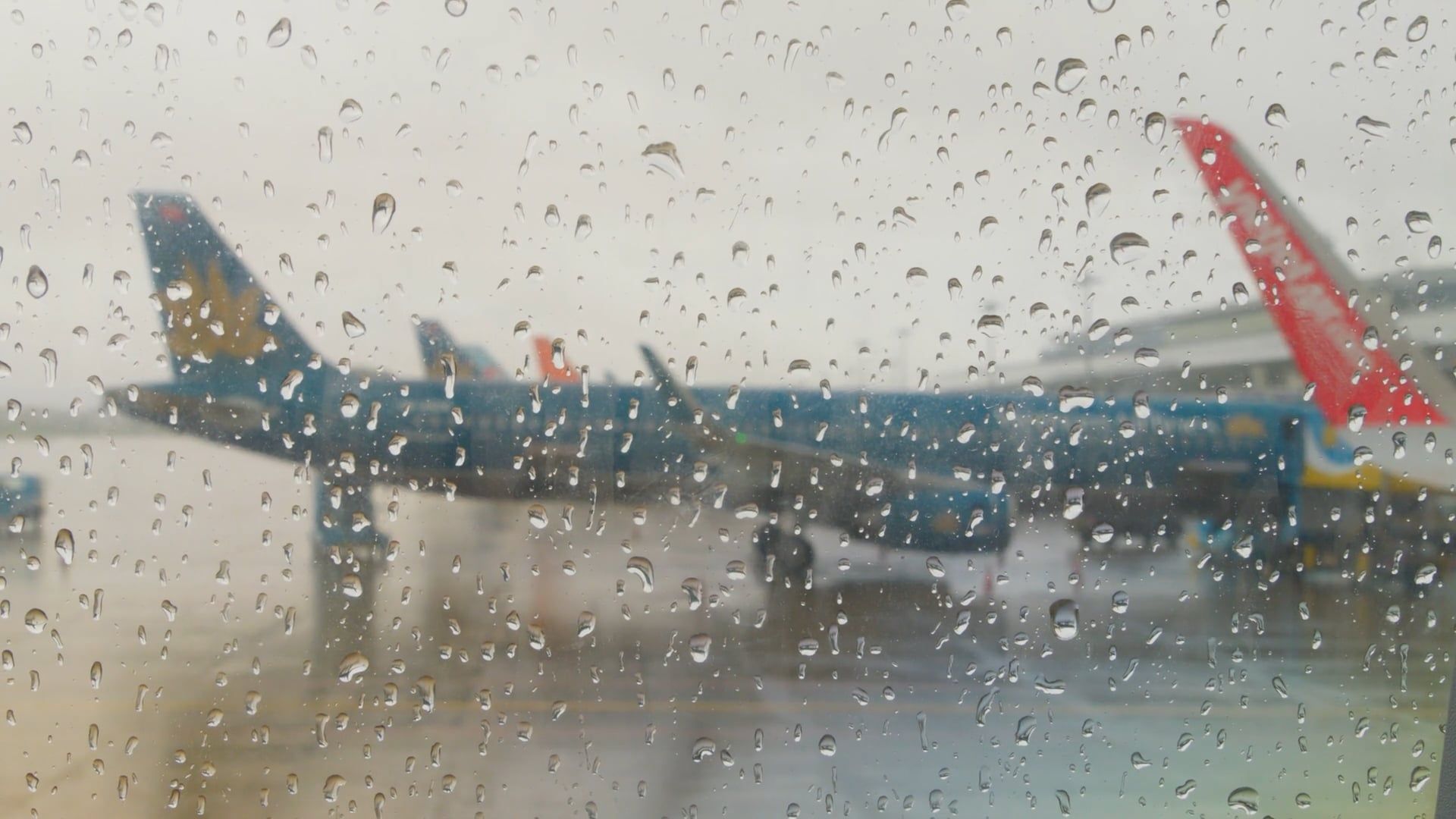 A plane is seen through a window with rain Free Stock Video Footage ...