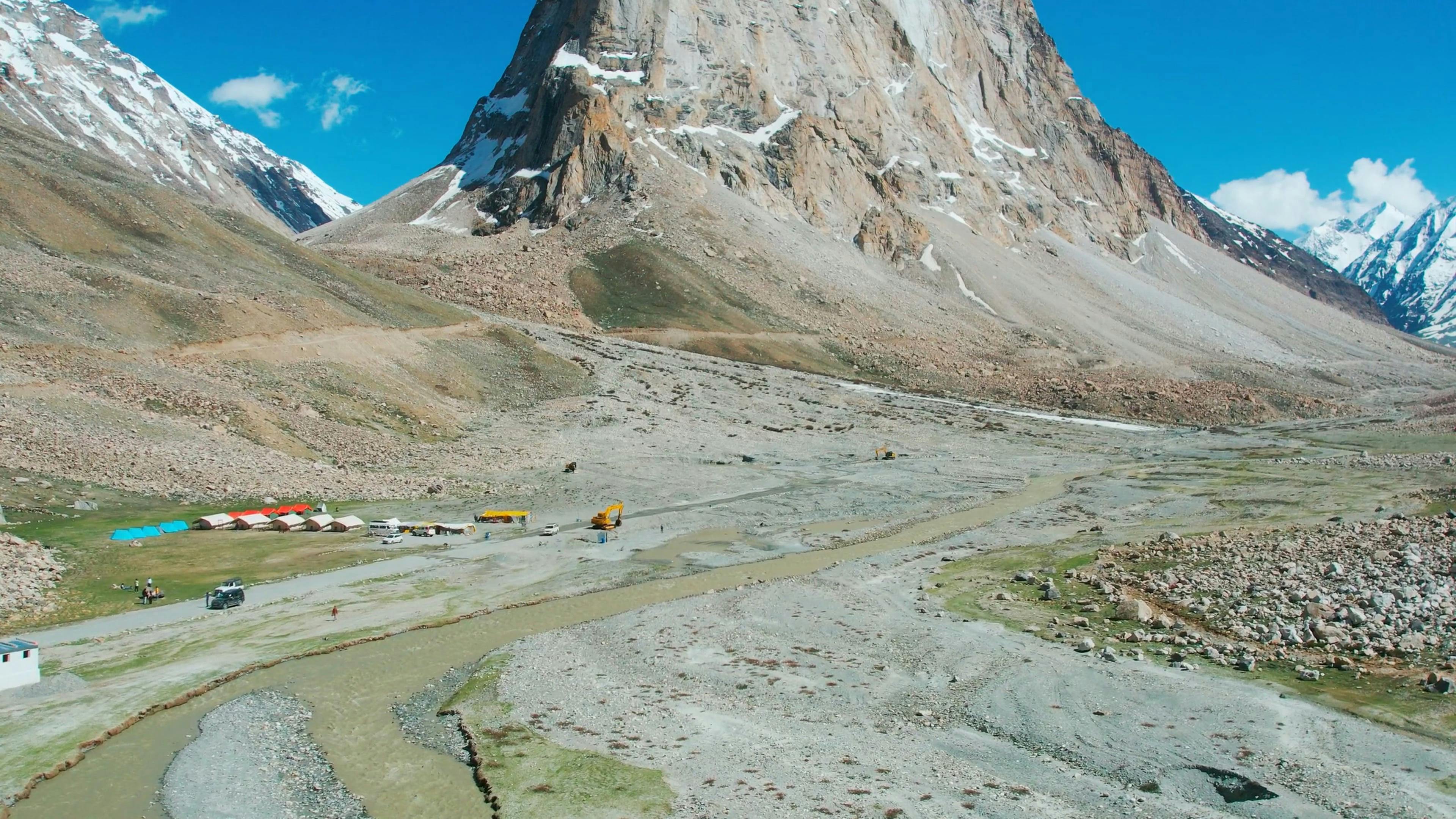 The Kargyak river with the granite mountain peak of Mount Gumbok ...
