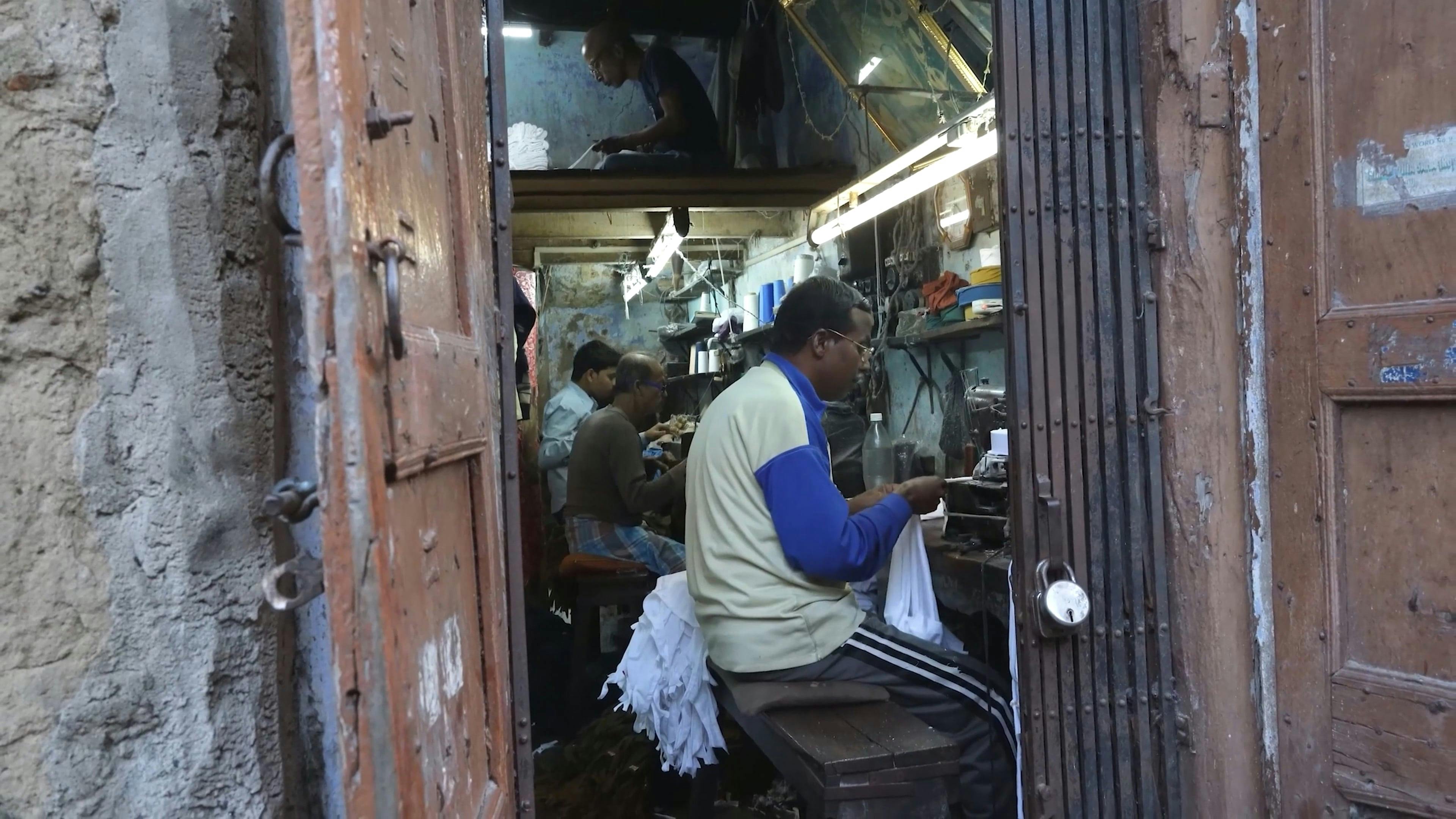 Group of Old Indian Traditional Tailors sewing clothes in a old shop of ...