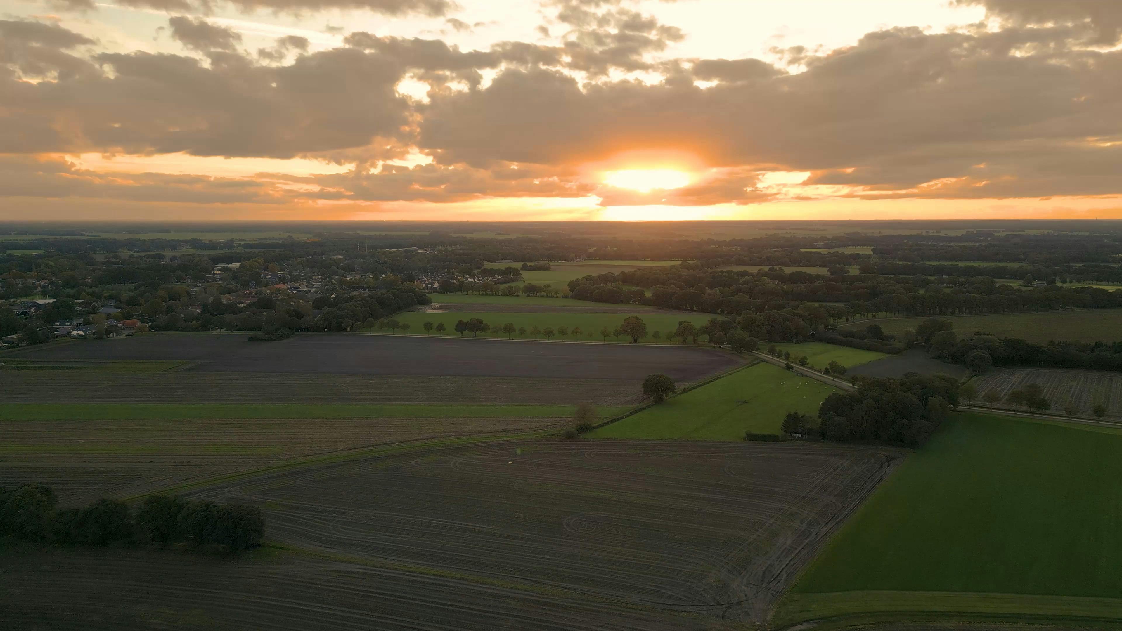 Aerial view of a farm and a field at sunset Free Stock Video Footage ...