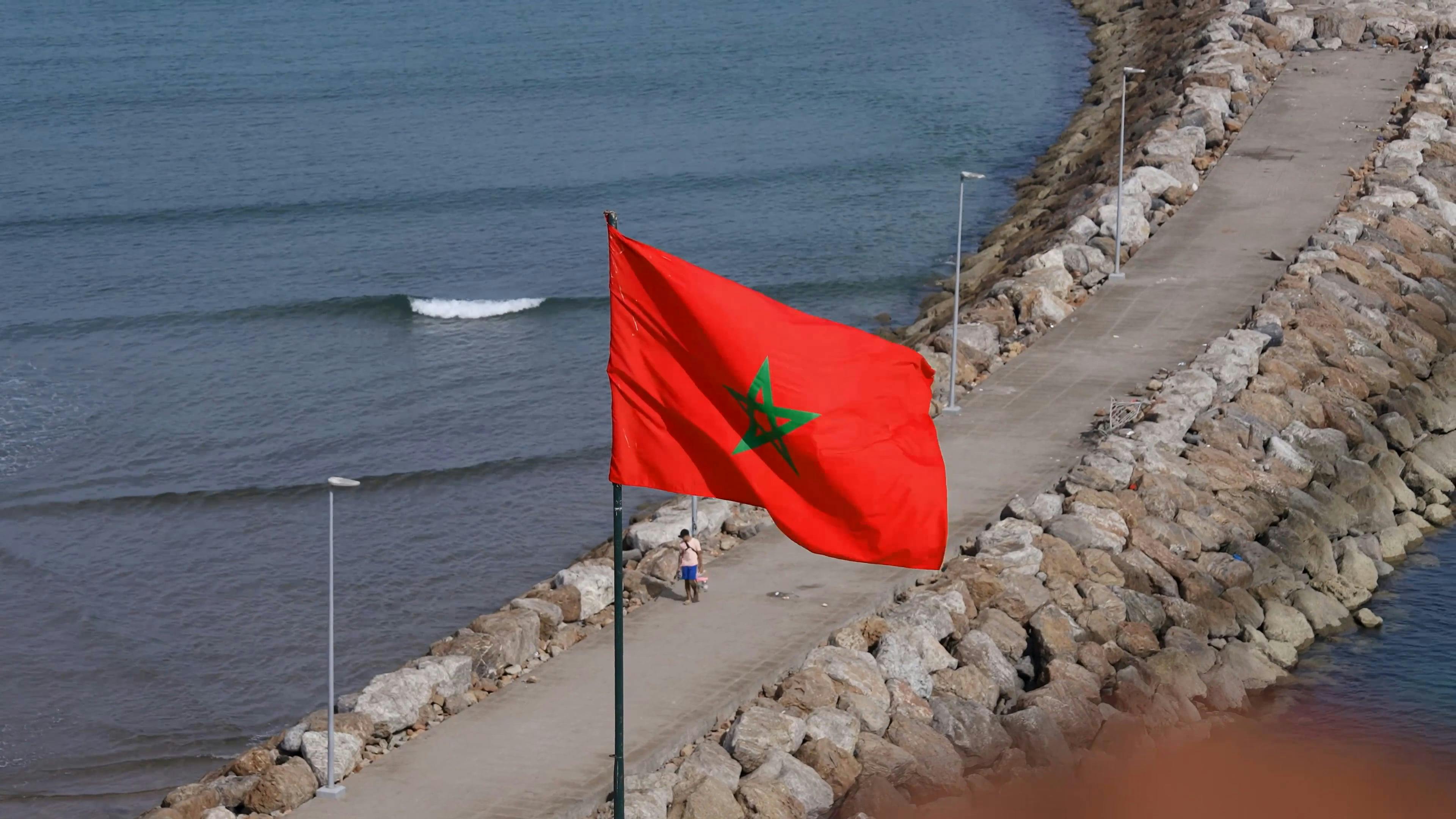 A red flag flies over the ocean in morocco Free Stock Video Footage ...