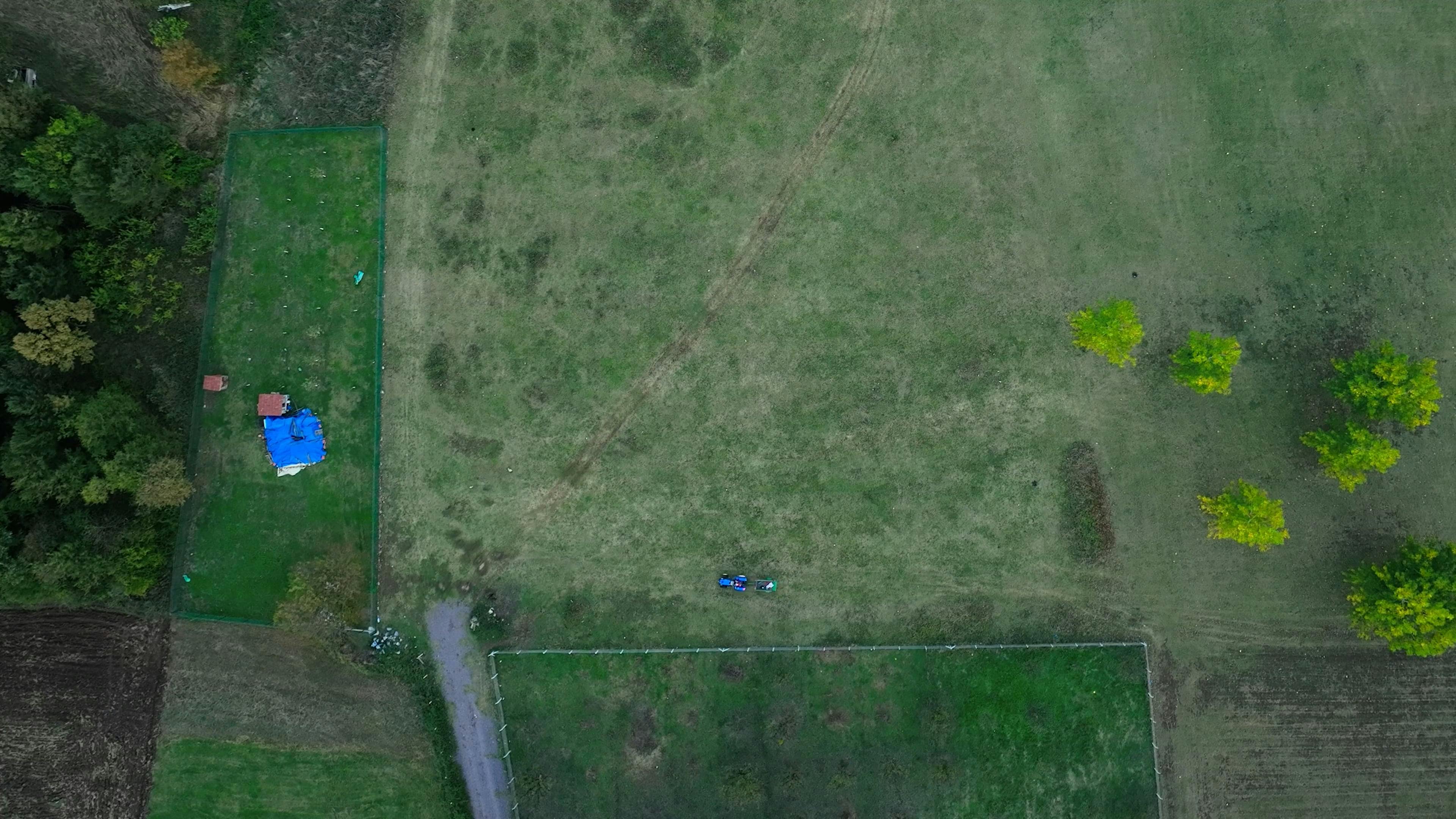 Aerial view of a small house in the middle of a field Free Stock Video ...