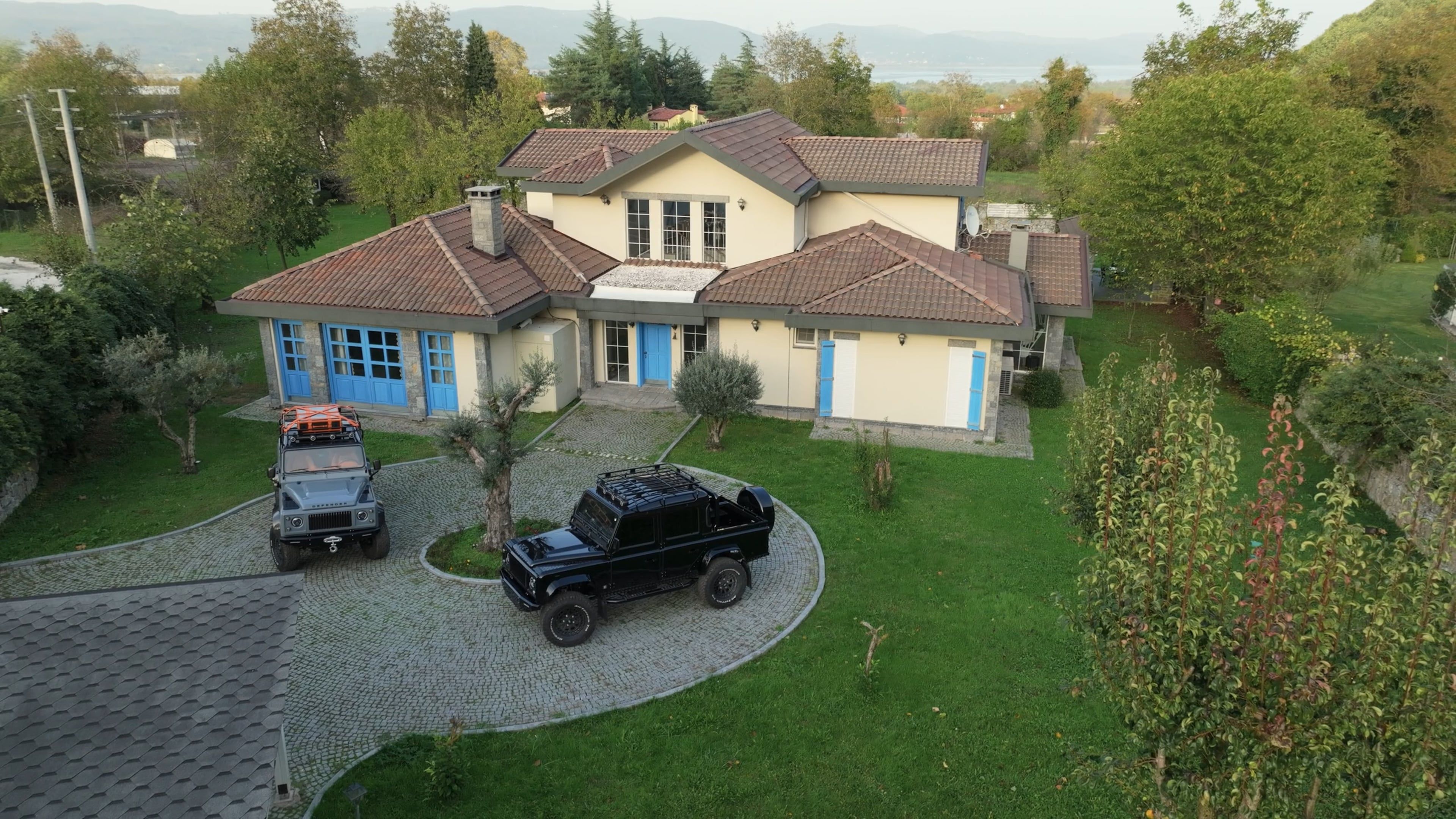 A large house with two cars parked in front Free Stock Video Footage ...
