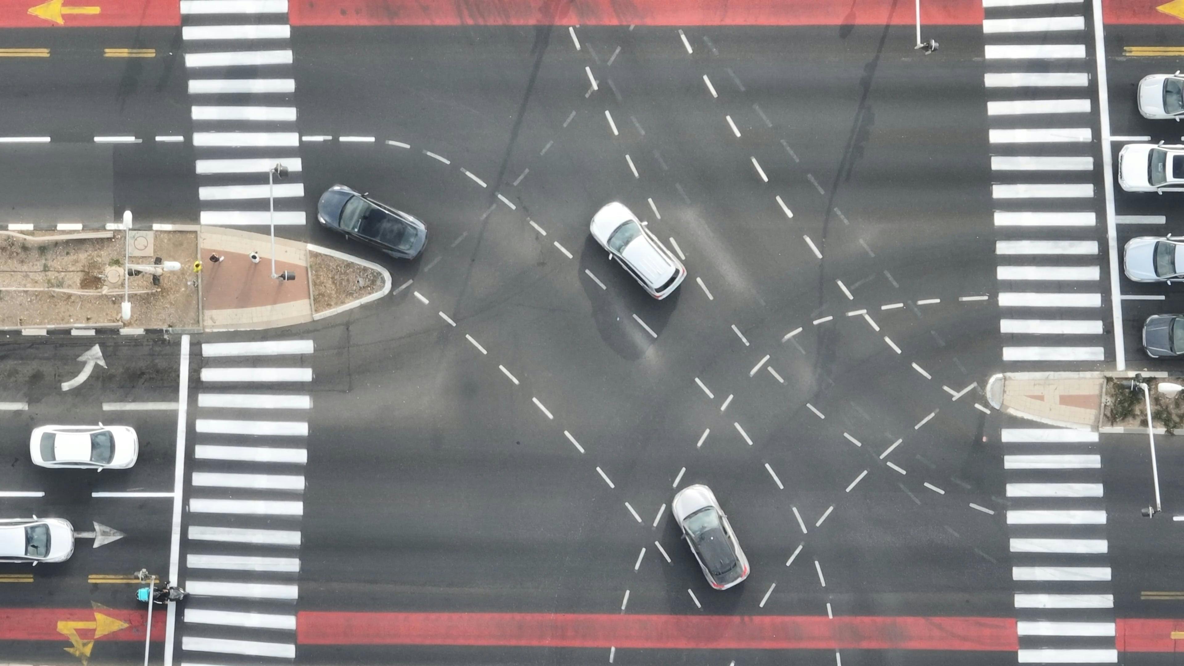 An overhead view of a crosswalk with cars Free Stock Video Footage ...