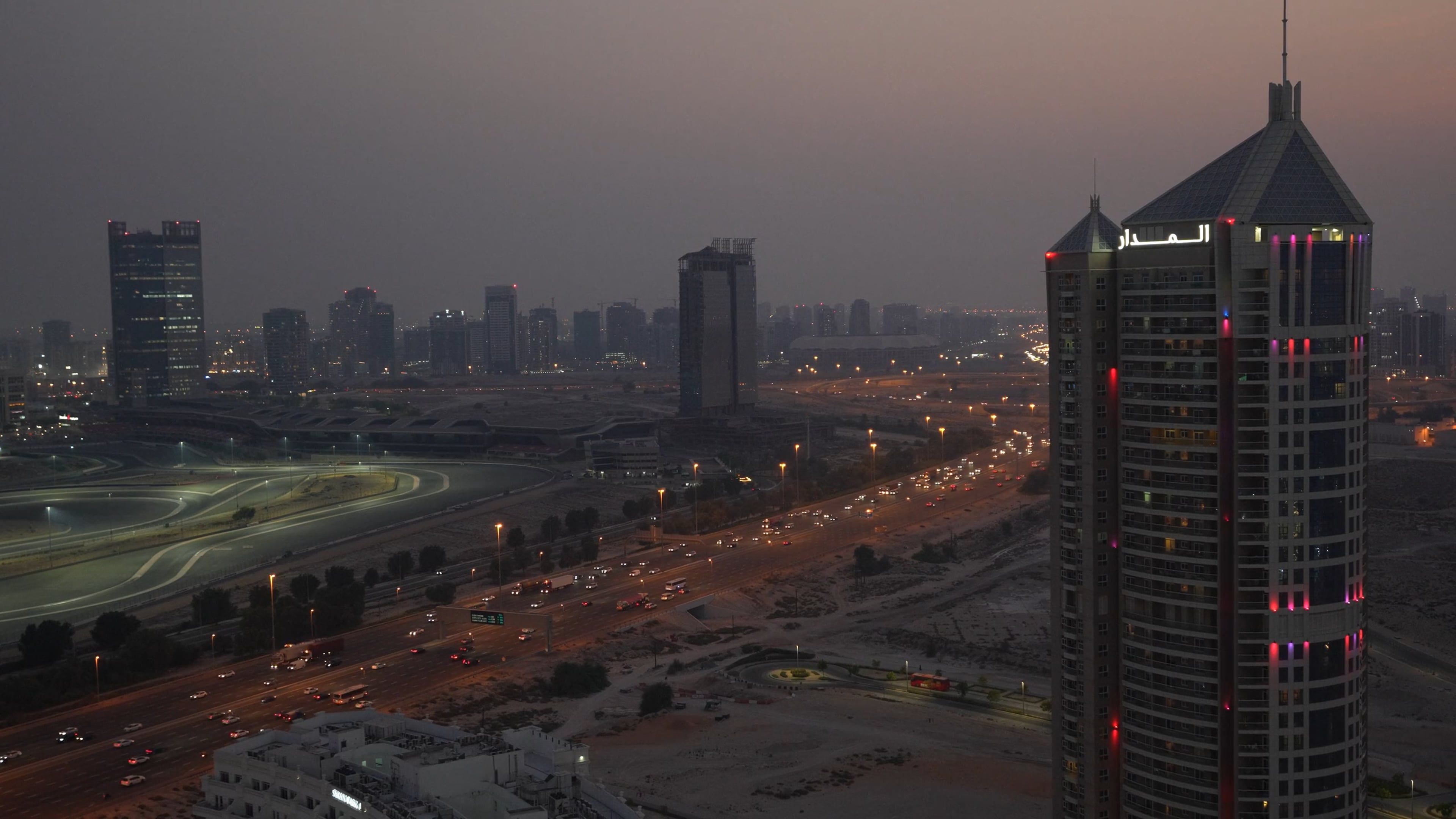 A city skyline at dusk with buildings and cars Free Stock Video Footage ...