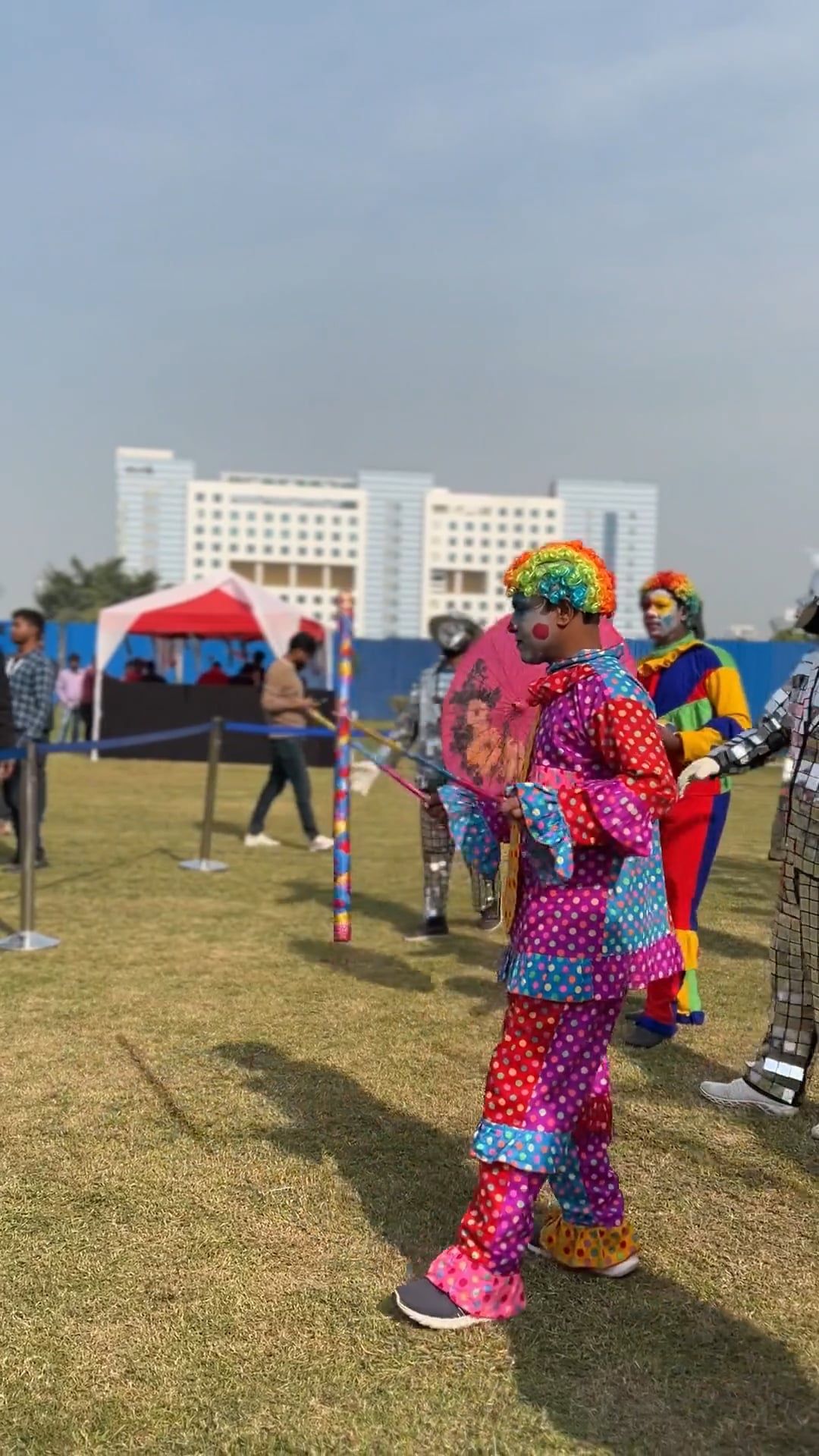 A clown in a colorful costume is walking on the grass Free Stock Video ...