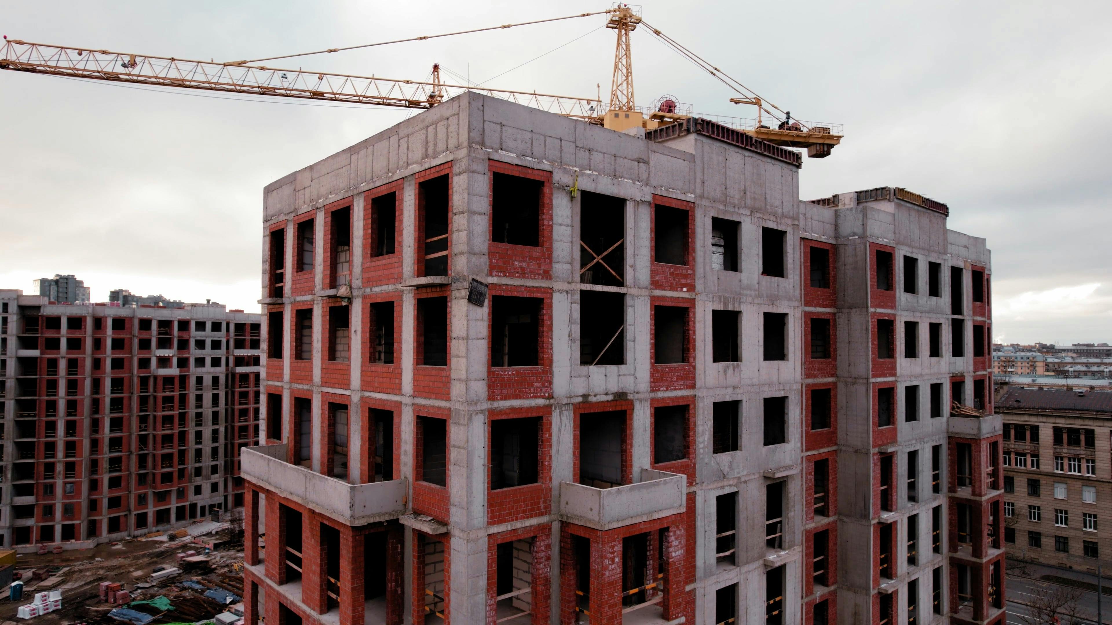 A crane is seen in front of a building Free Stock Video Footage ...