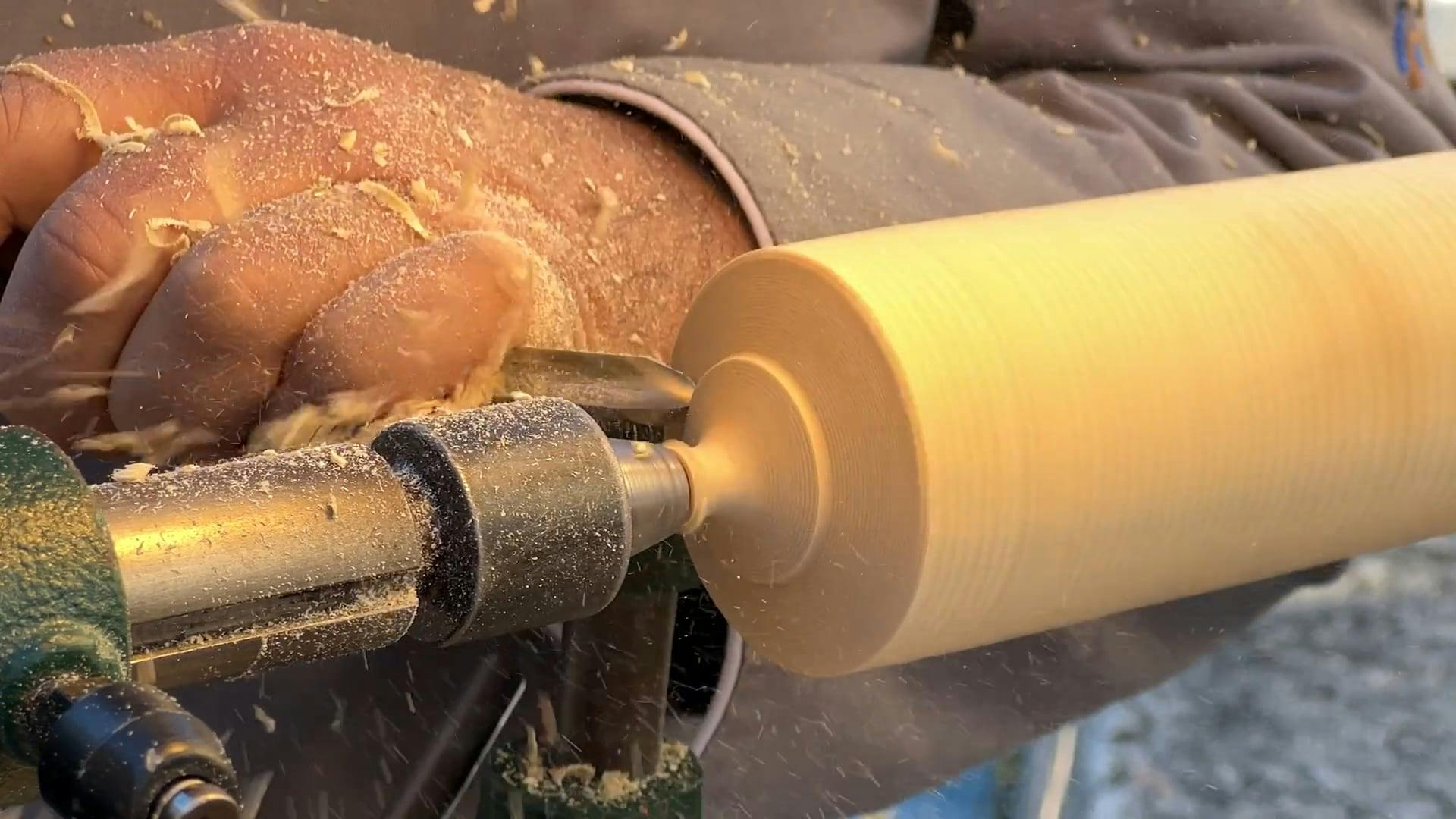 A person is using a wood lathe to make a wooden pipe Free Stock Video ...